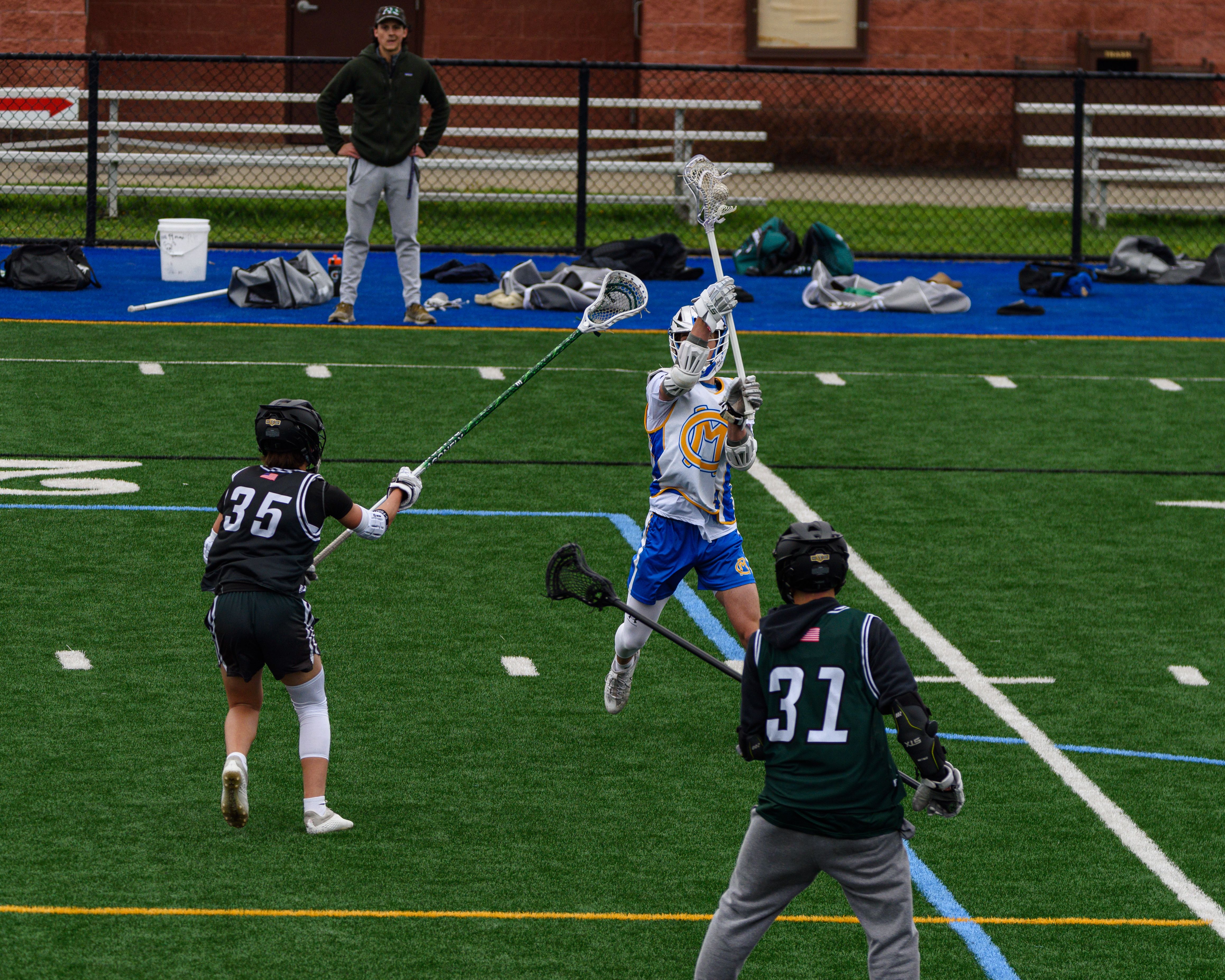Intense Outdoor Lacrosse Game Action · Free Stock Photo
