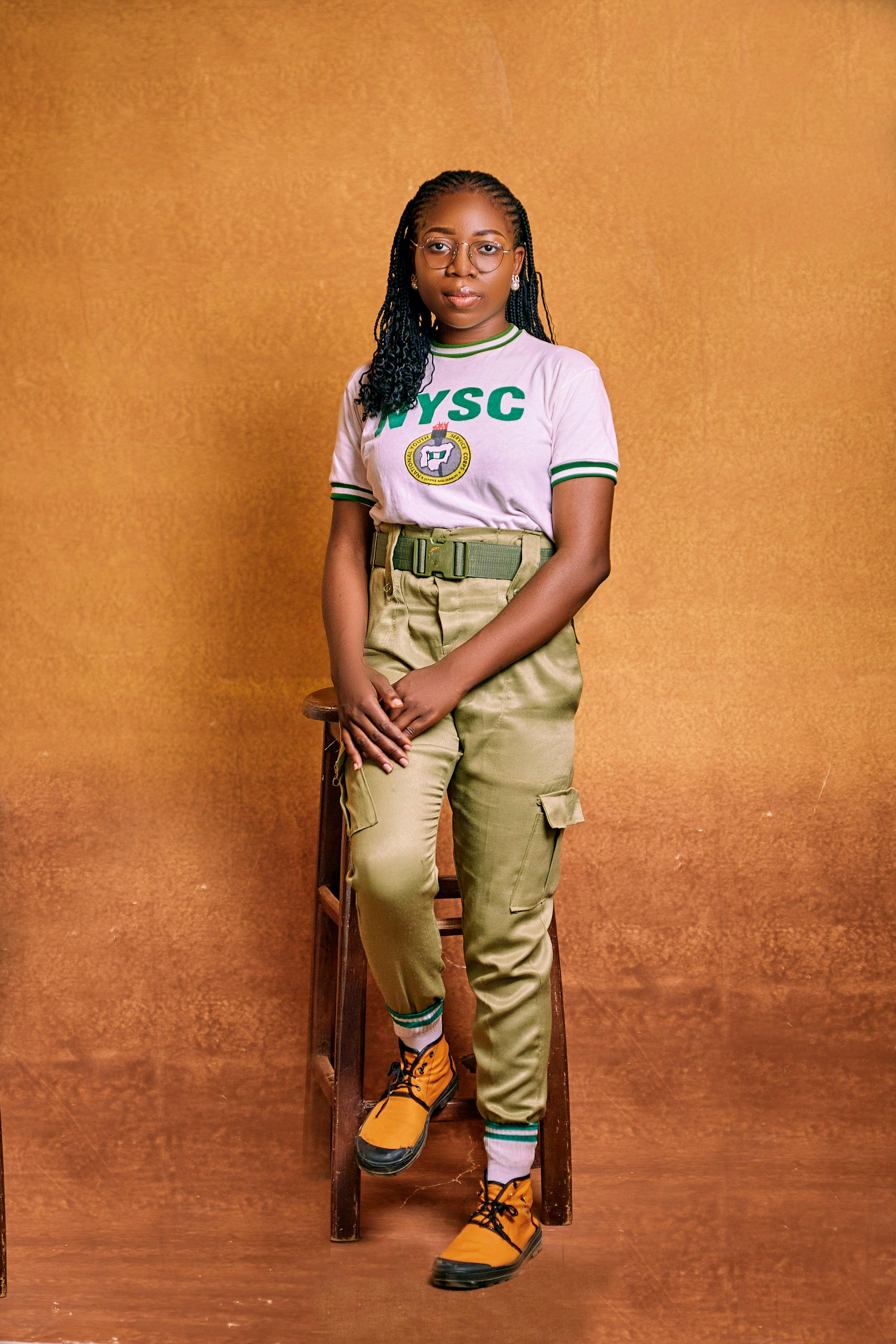 Portrait of a Young Woman in NYSC Uniform · Free Stock Photo
