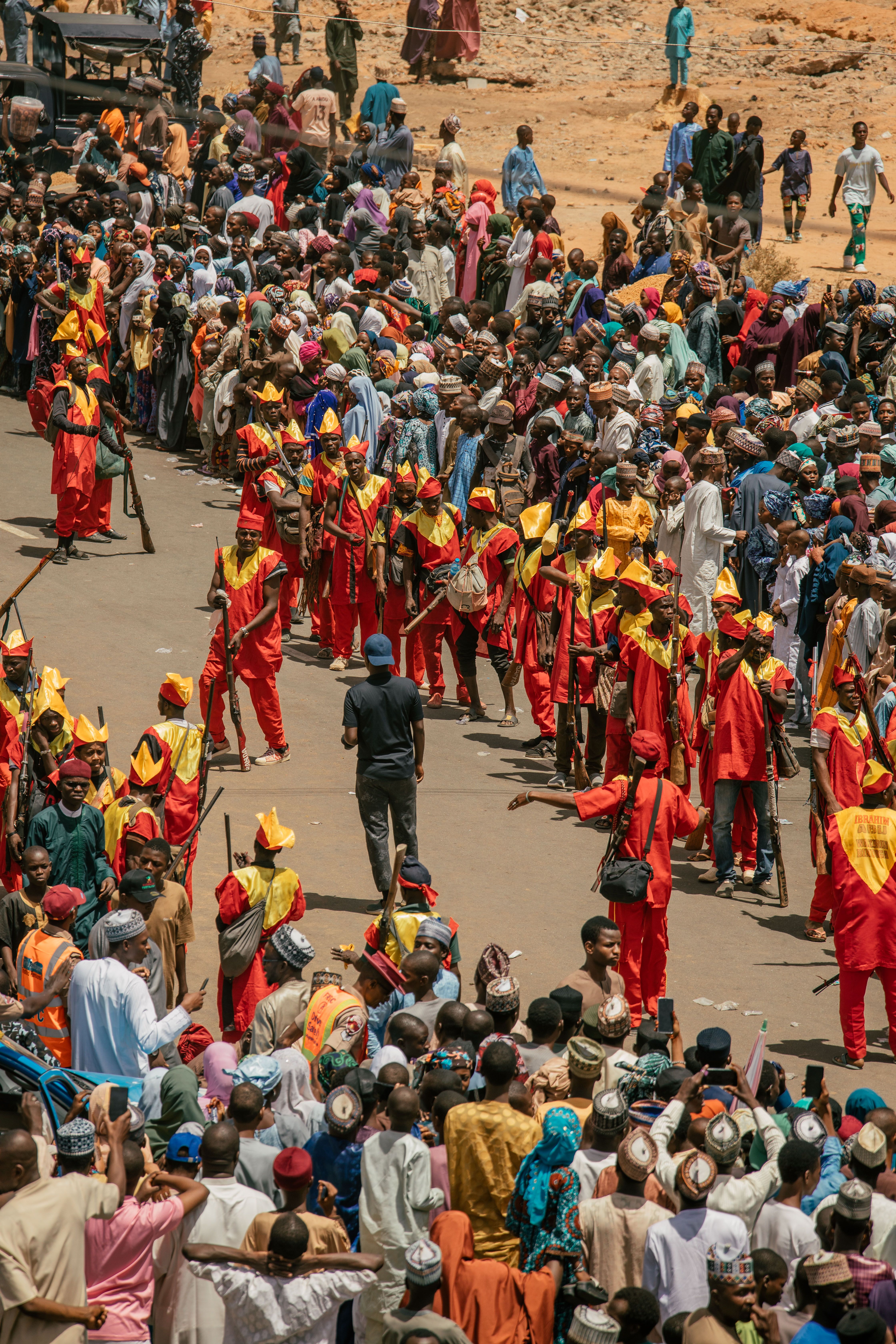Vibrant Cultural Parade with Onlookers Gathered · Free Stock Photo