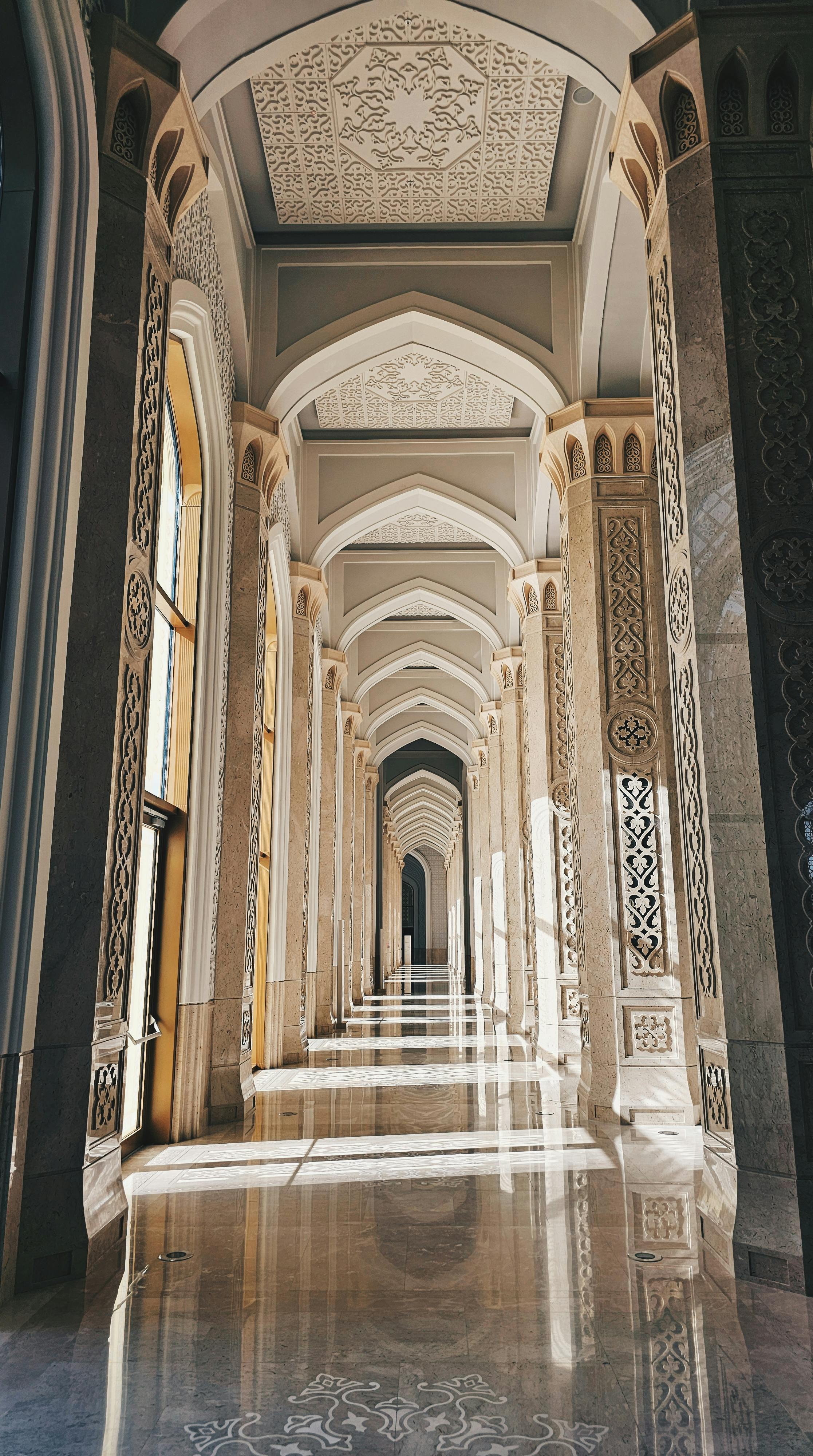 A Low Angle Shot of a Hallway Inside the Mosque · Free Stock Photo