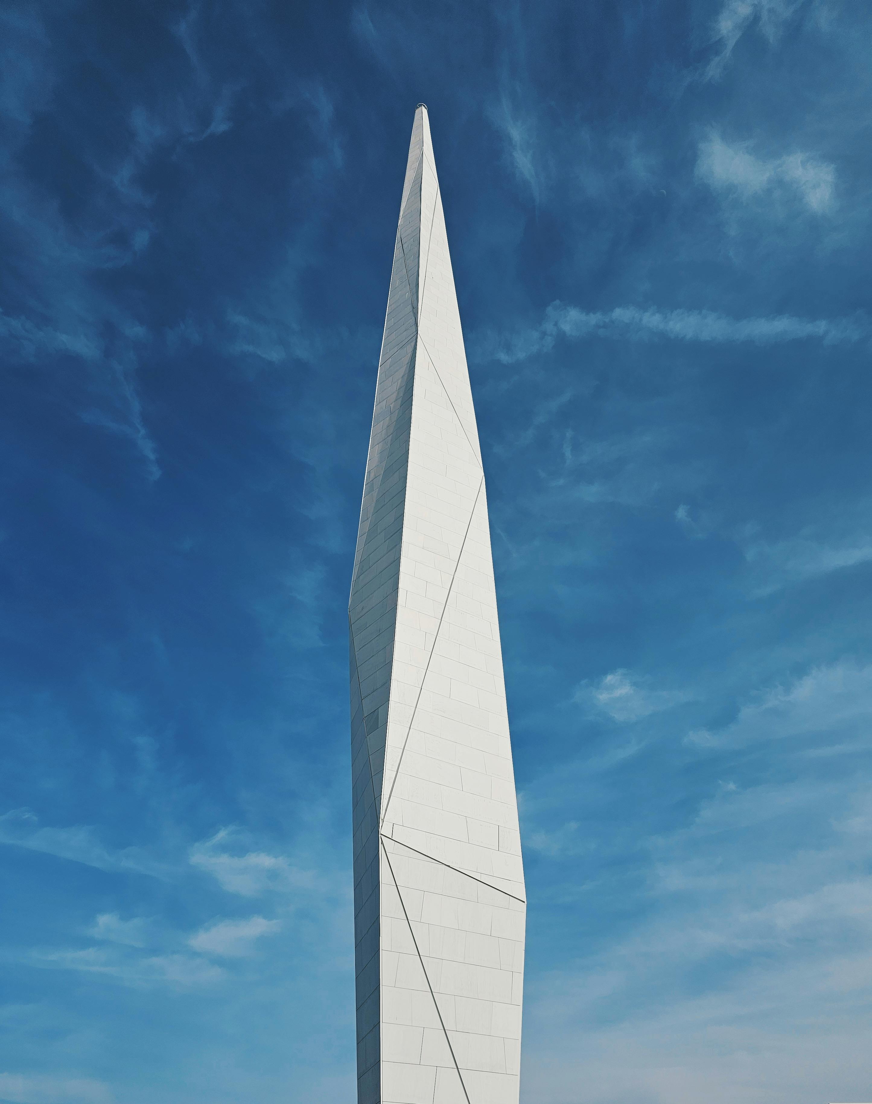 Modern Spire Against Blue Sky · Free Stock Photo