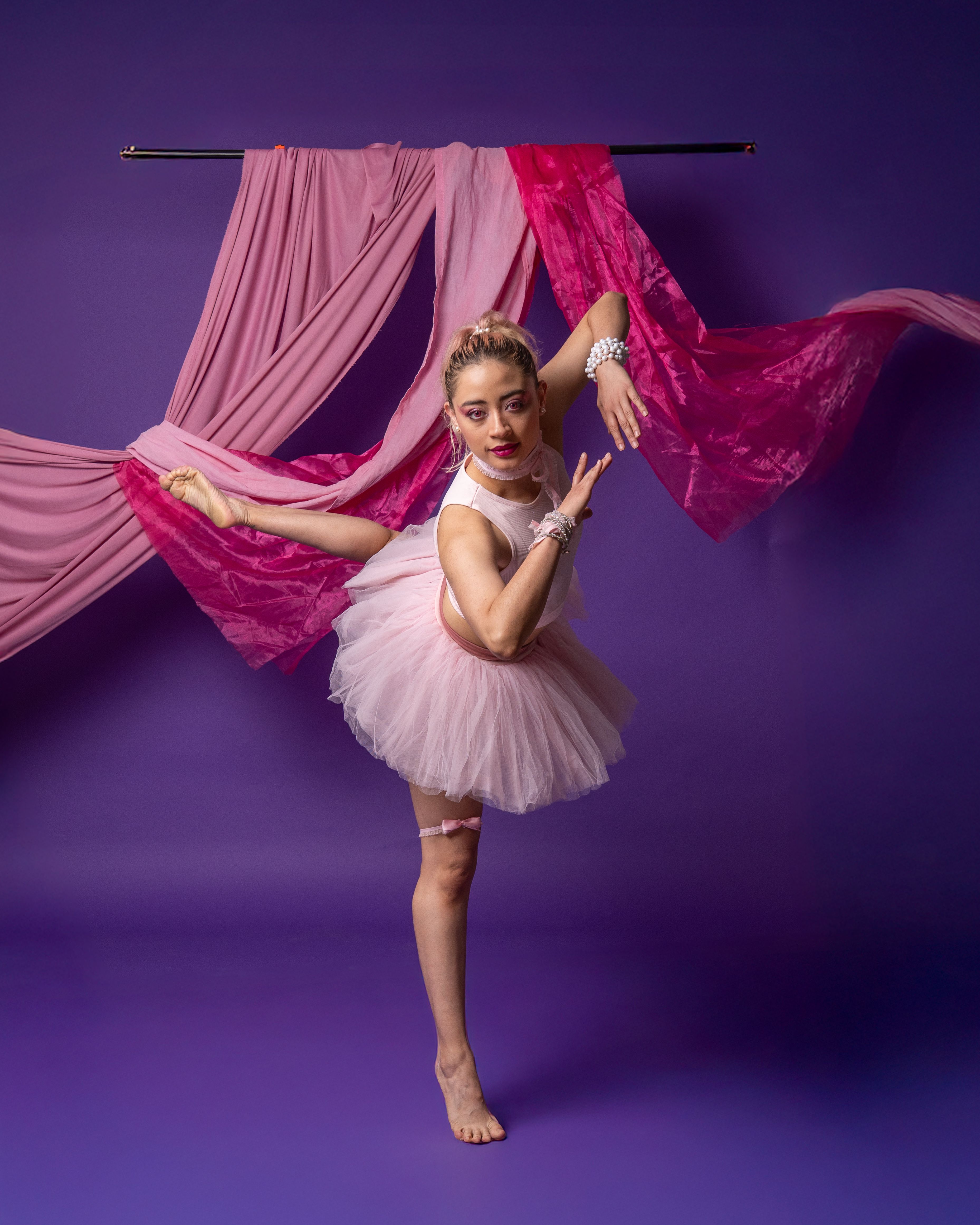 Elegant Pose of Ballet Dancer in Pink Attire · Free Stock Photo