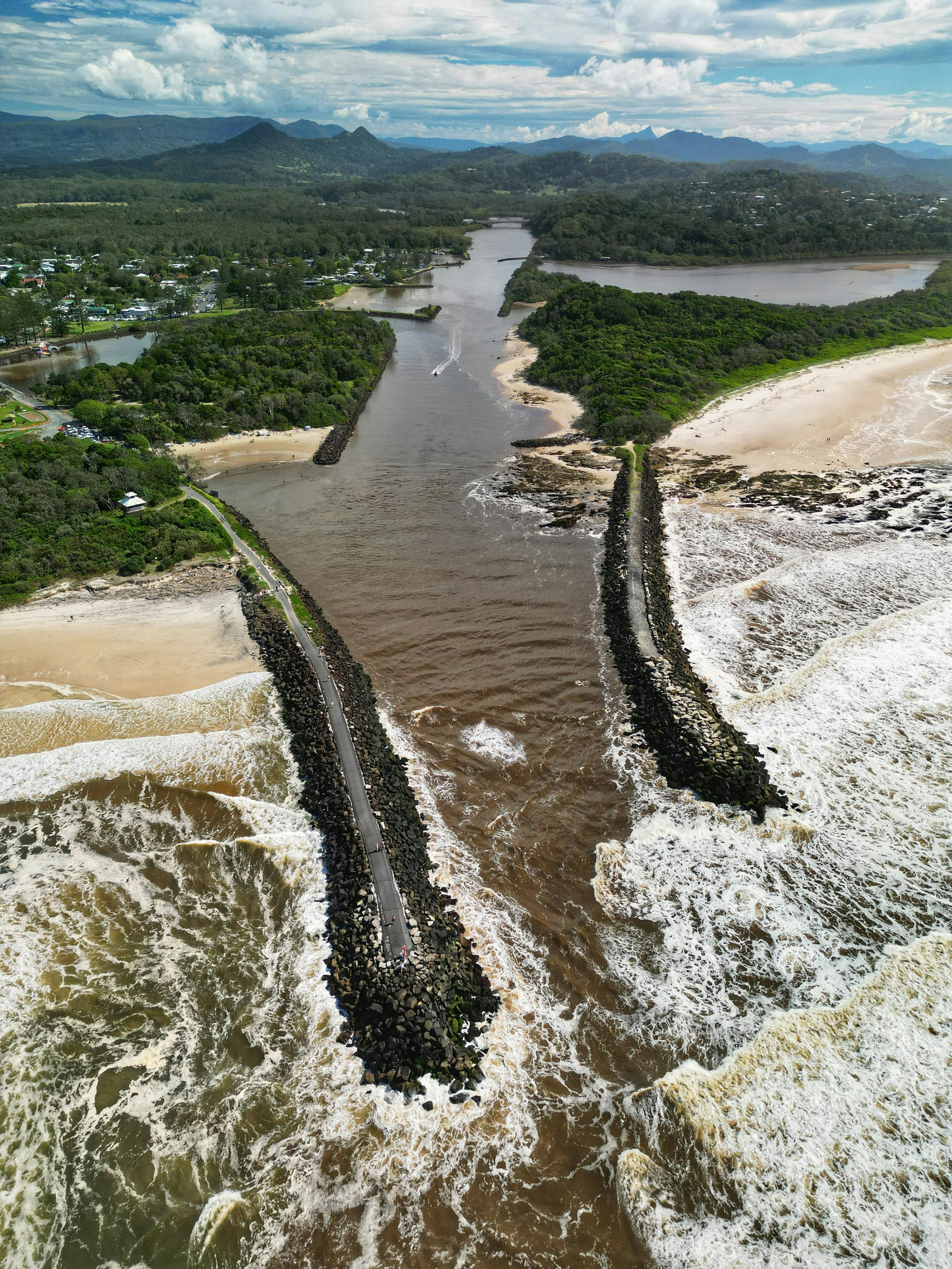 Aerial View of Coastal River Estuary and Breakwater · Free Stock Photo
