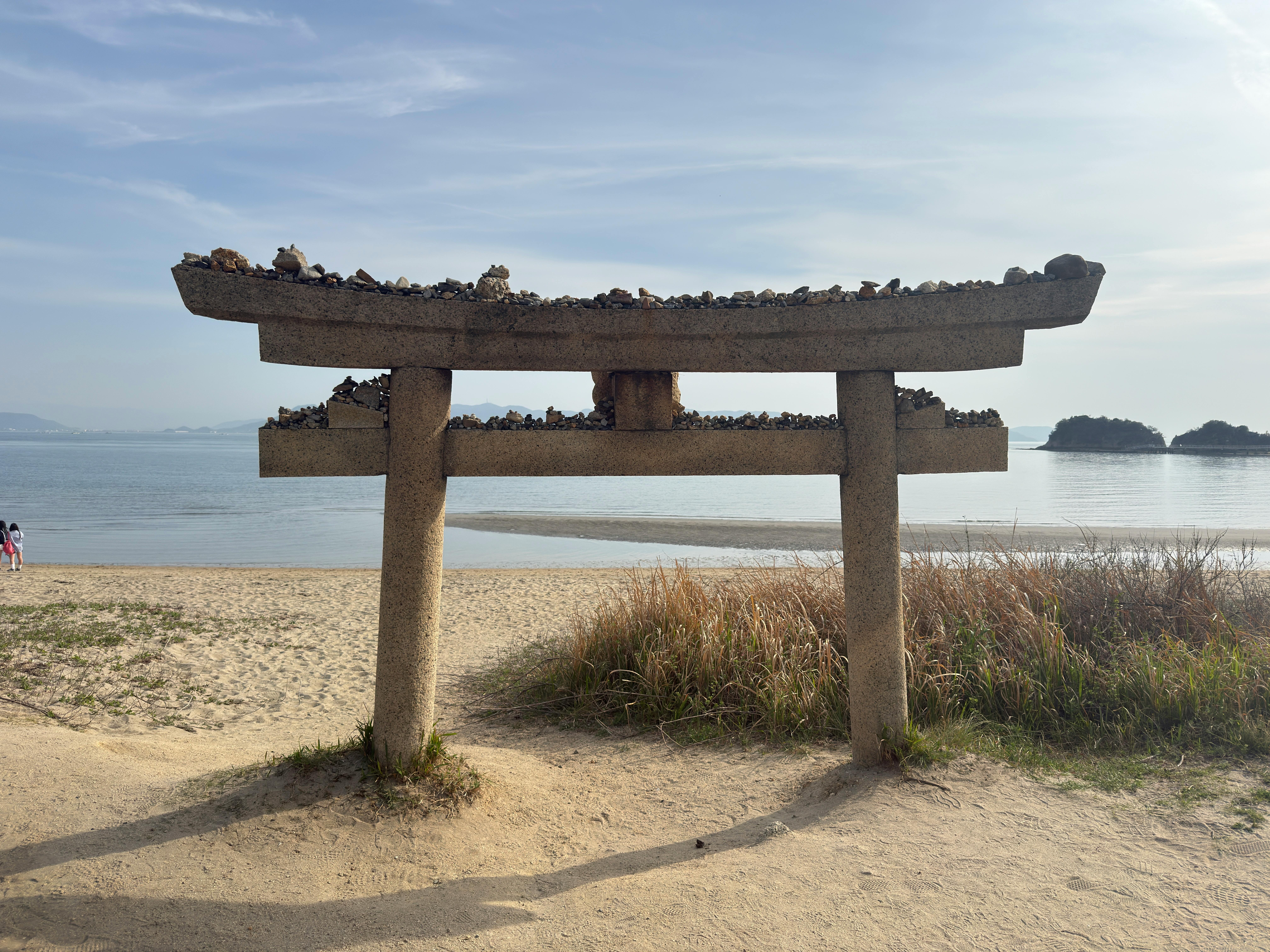 Traditional Torii Gate on Tranquil Beach · Free Stock Photo
