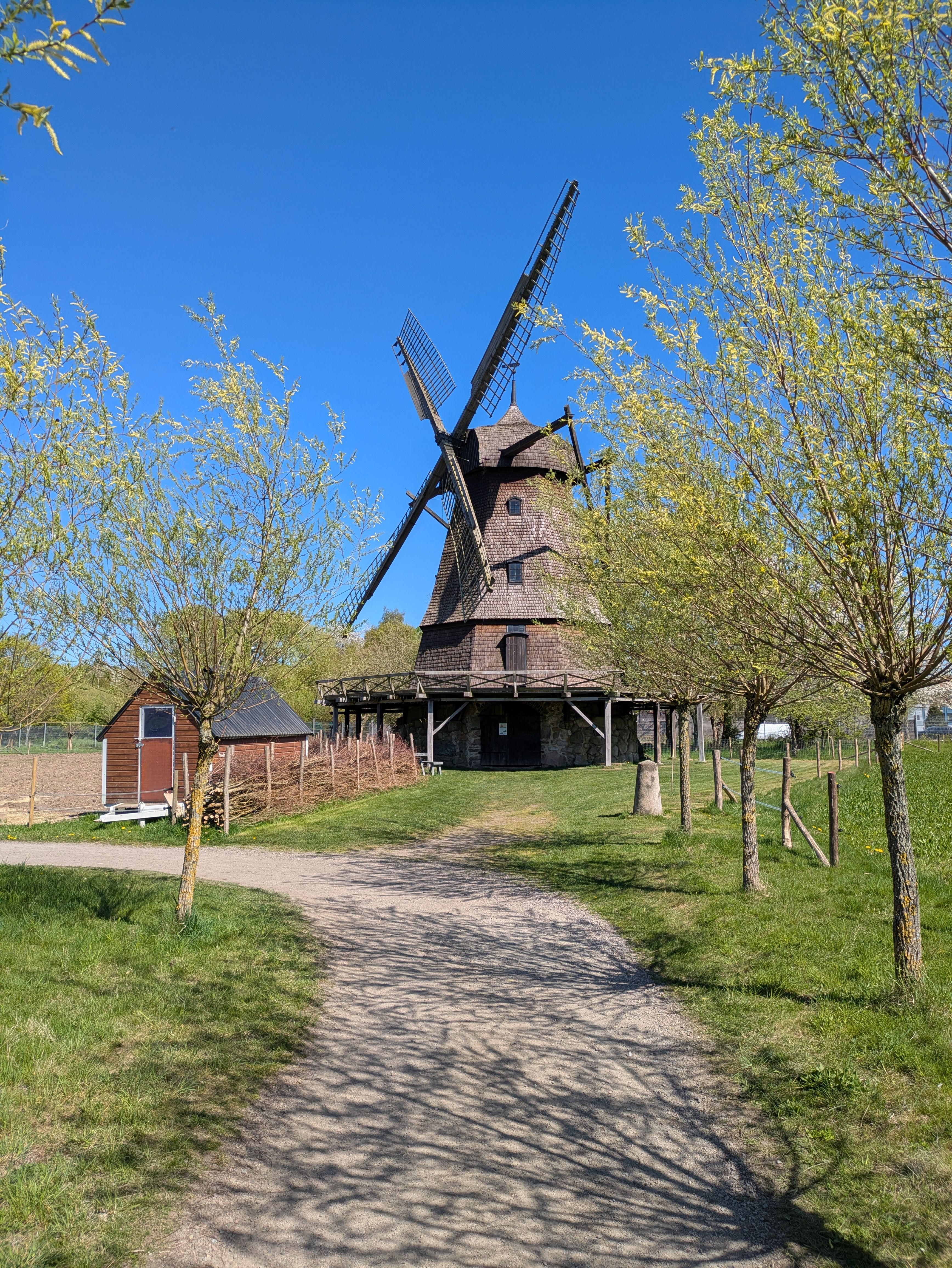 Historic Windmill Under Clear Blue Sky · Free Stock Photo