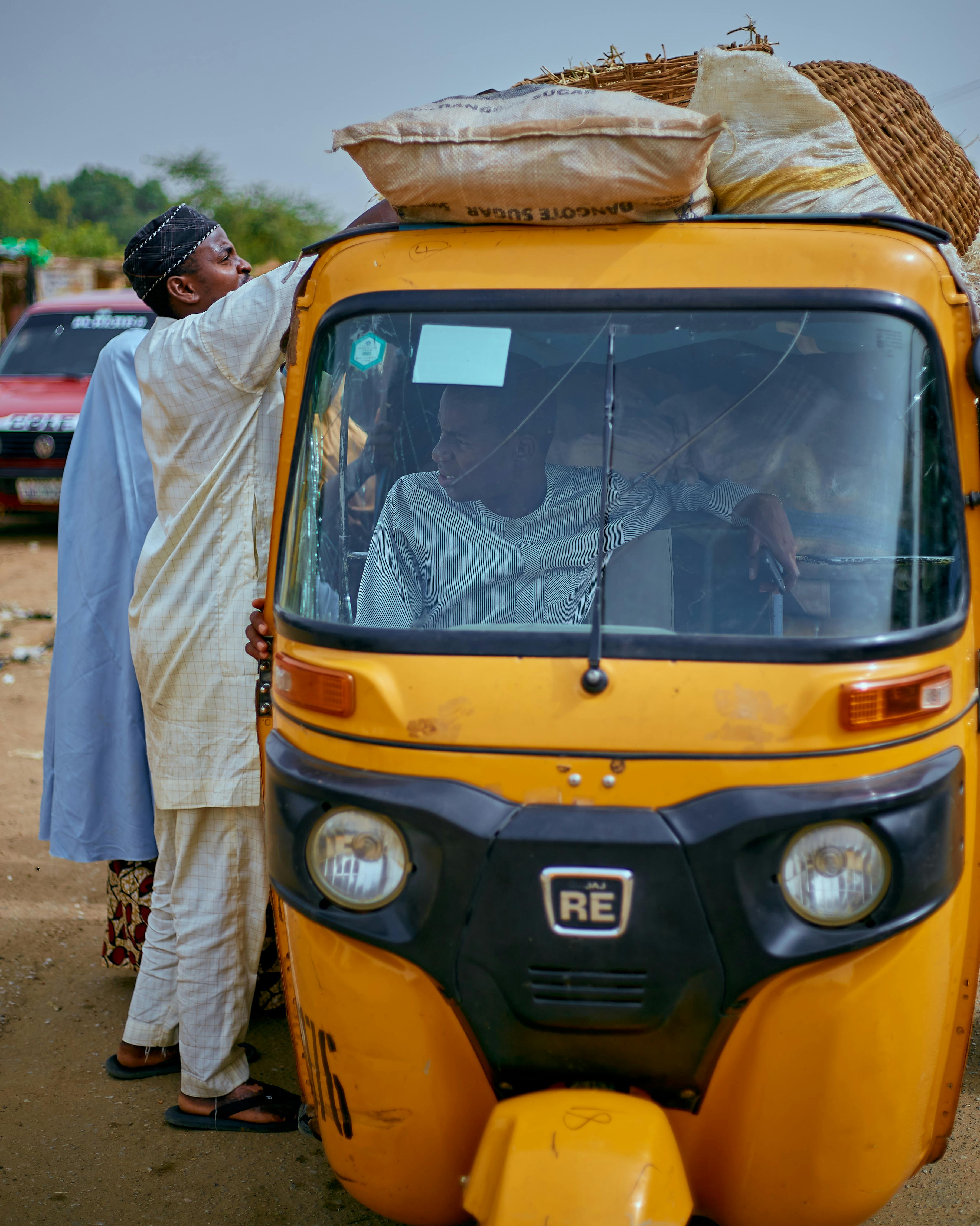 Crowded Rickshaw in Bustling Outdoor Market · Free Stock Photo