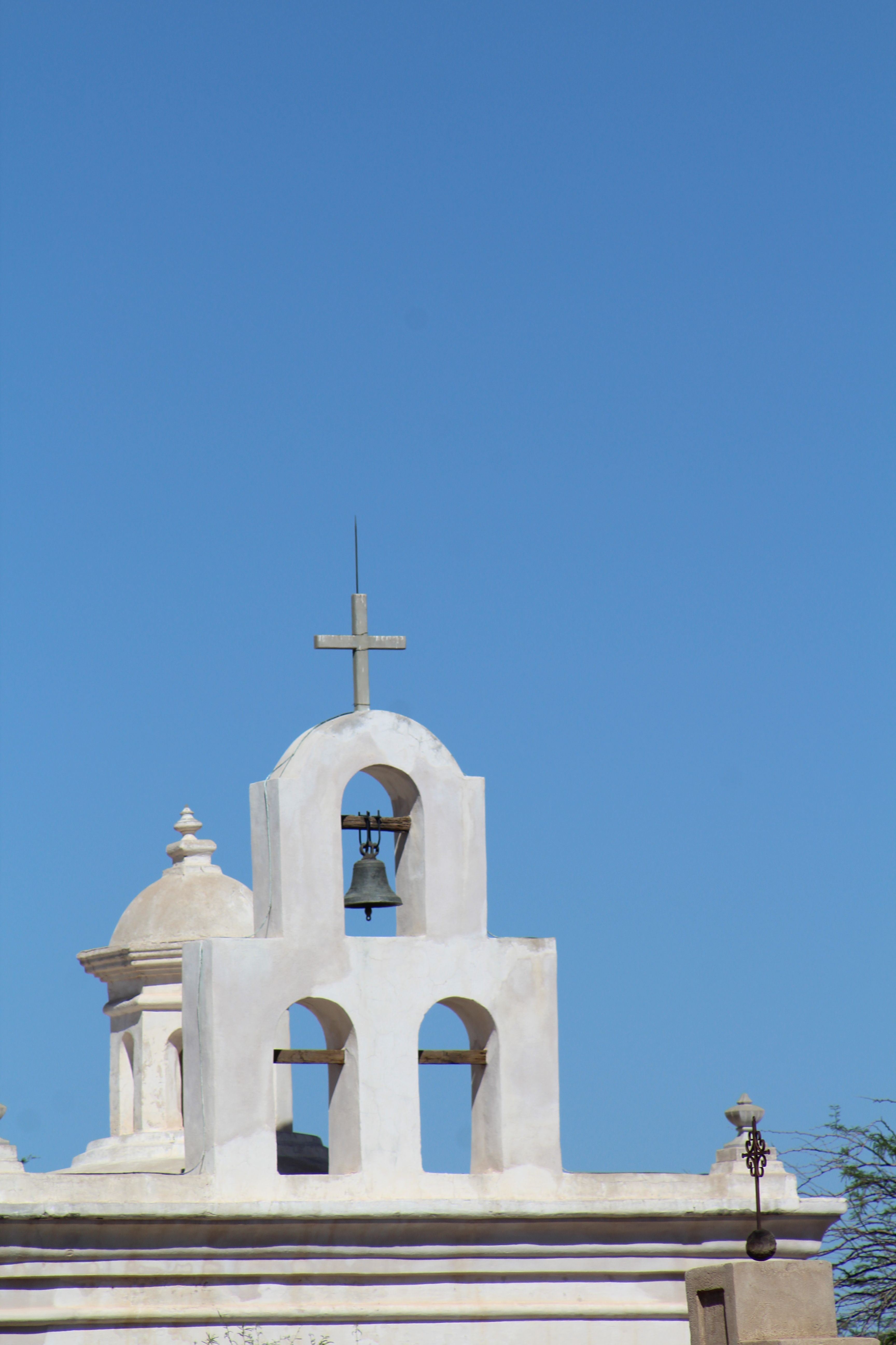 Historic White Church Bell Tower Against Blue Sky · Free Stock Photo
