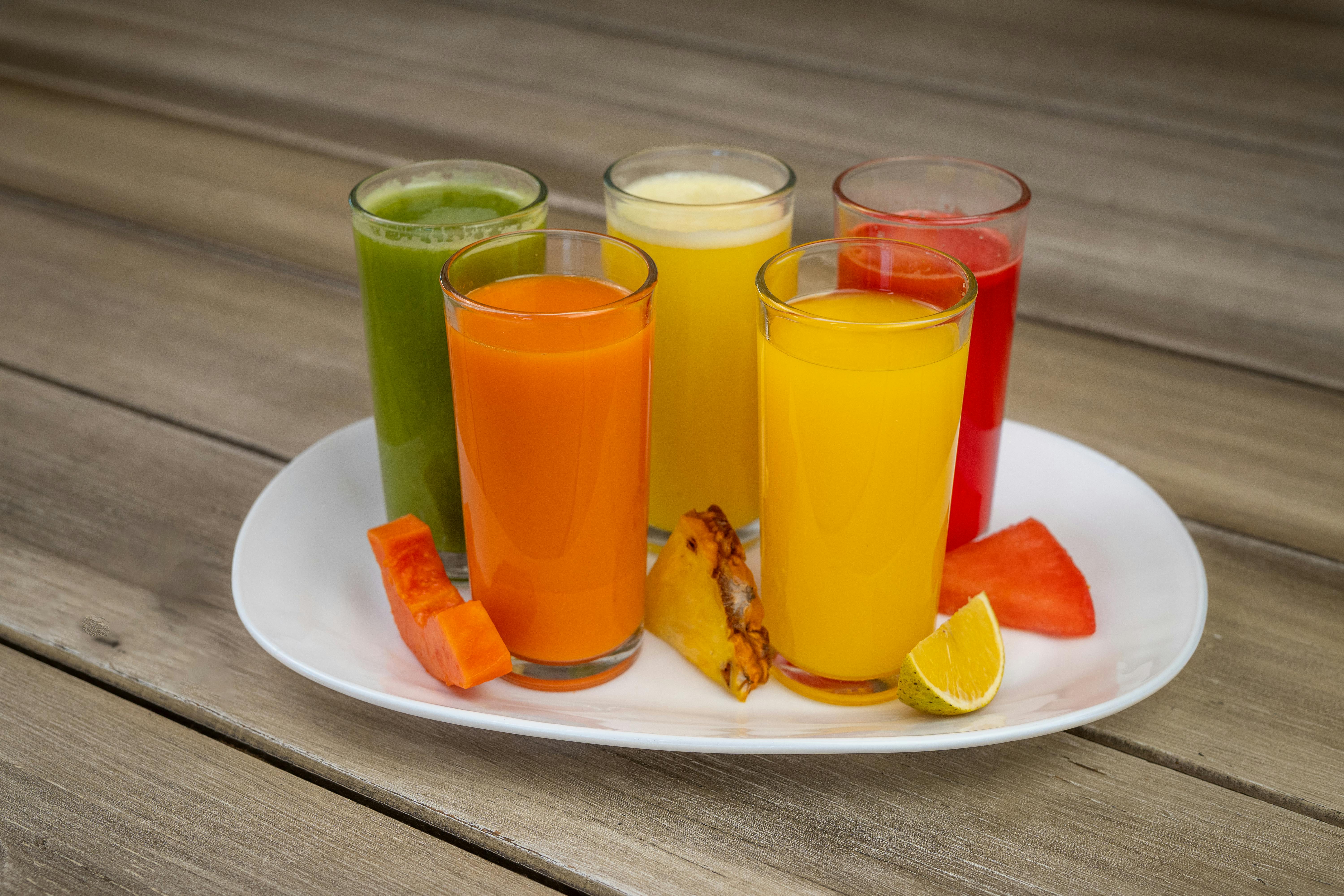 Vibrant Assortment of Fresh Fruit Juices · Free Stock Photo