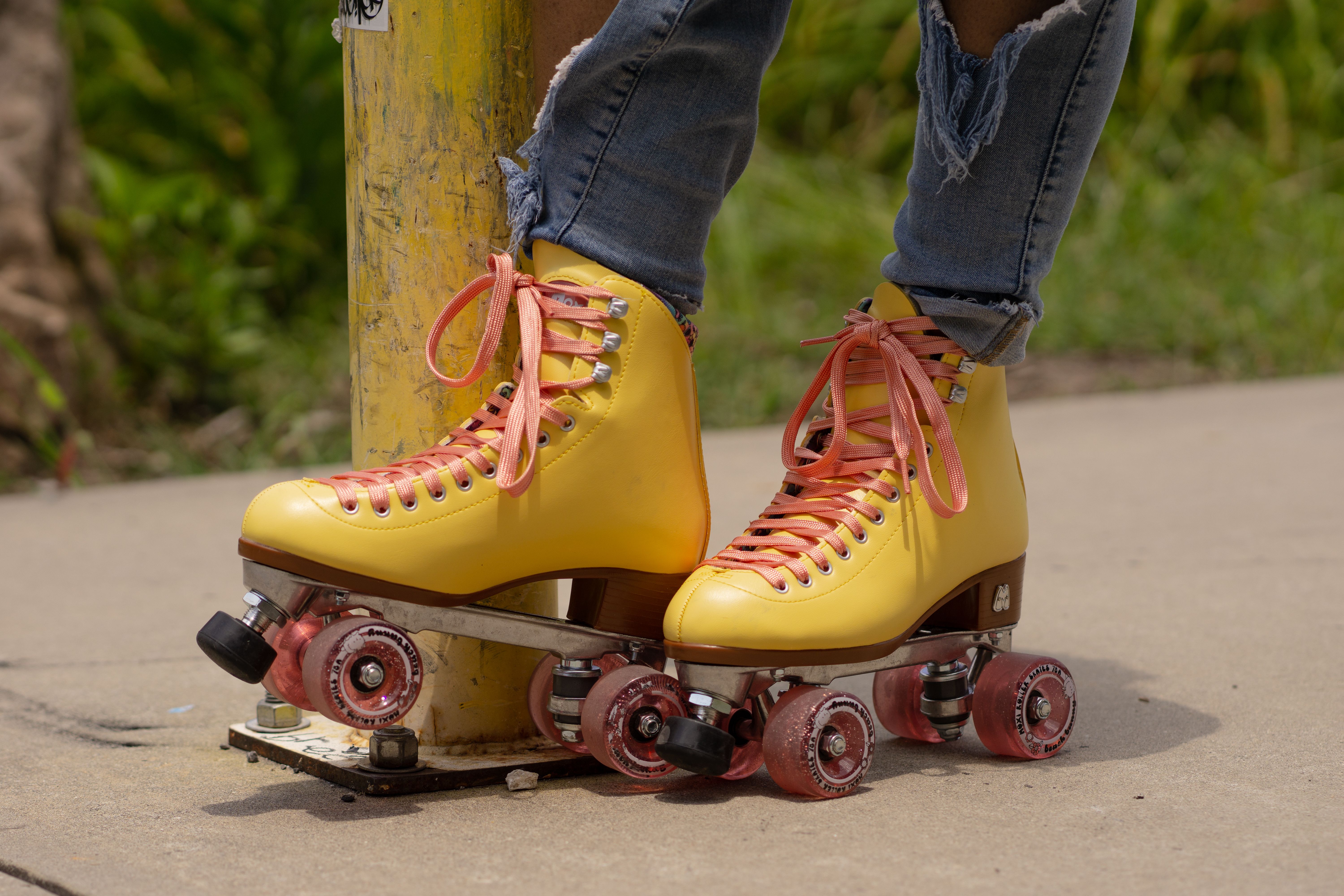 Bright Yellow Roller Skates on Urban Sidewalk · Free Stock Photo