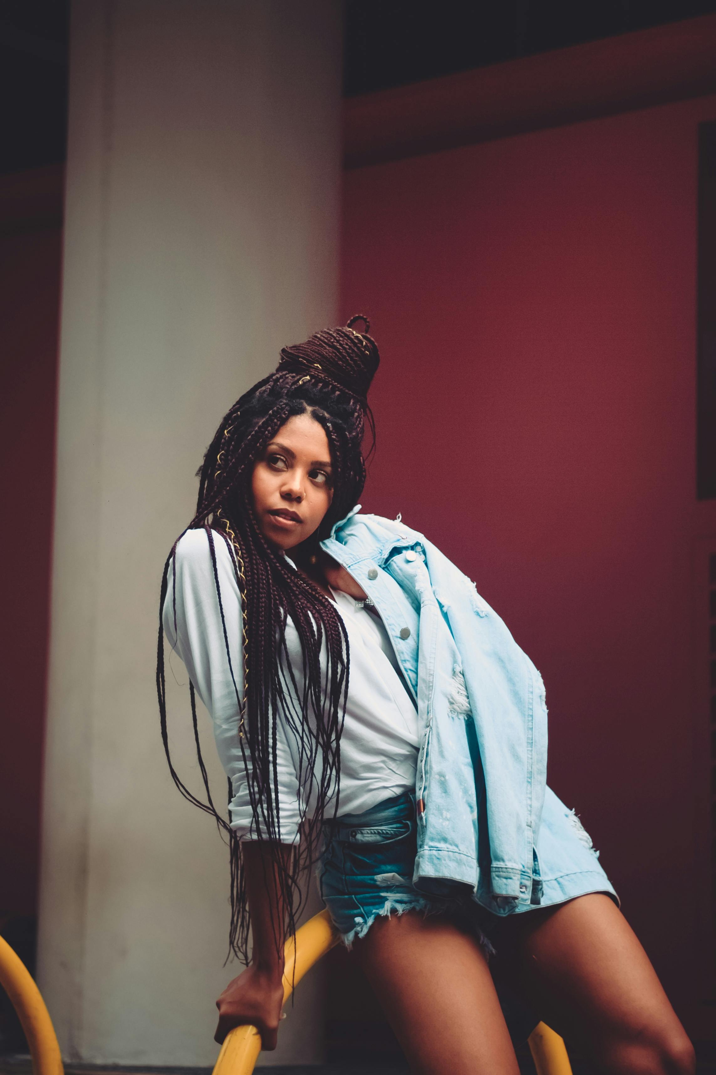 Photo of Woman Posing and Leaning on a Railing · Free Stock Photo