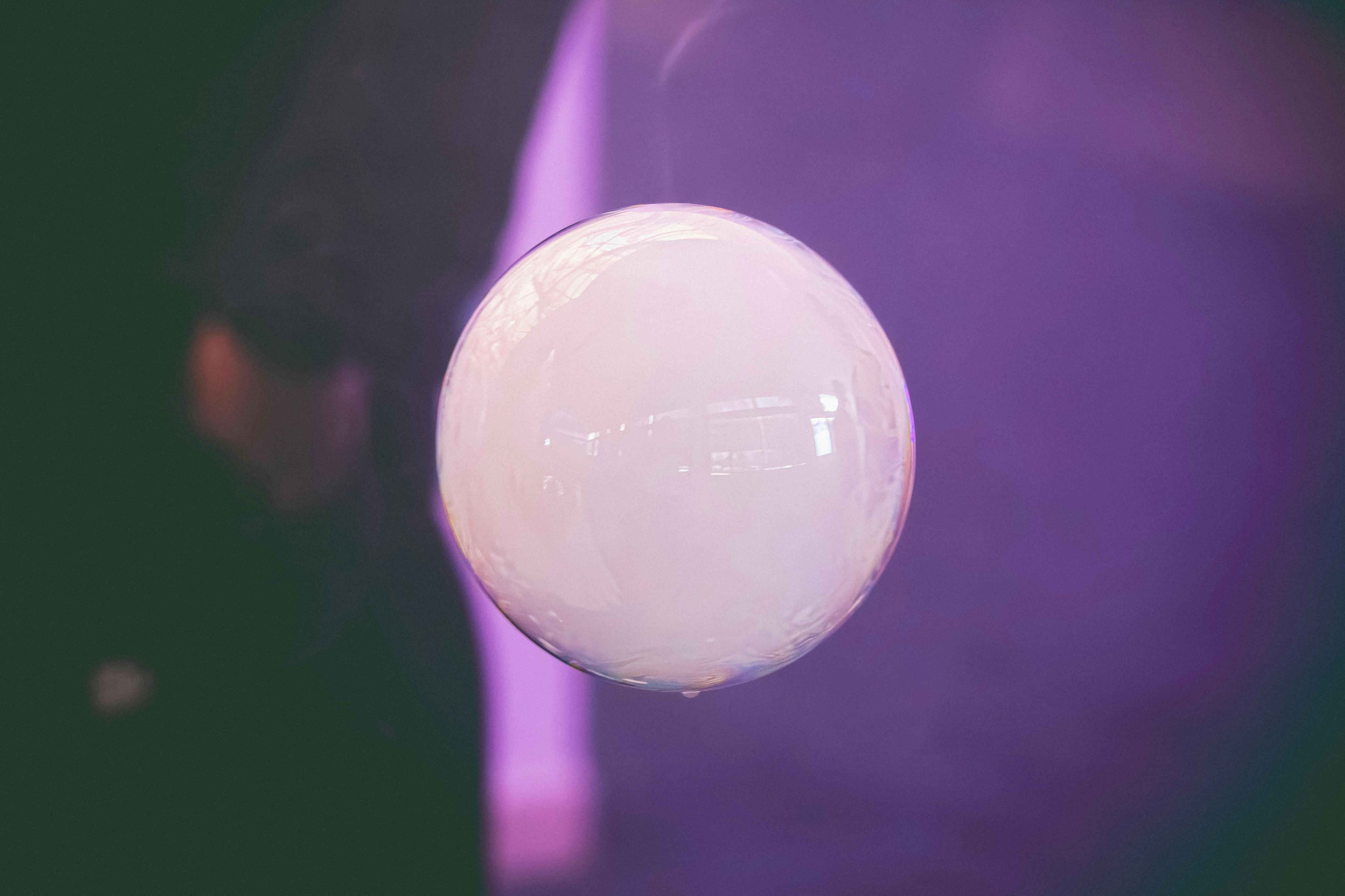 Close-Up of a Floating Soap Bubble with Reflection · Free Stock Photo