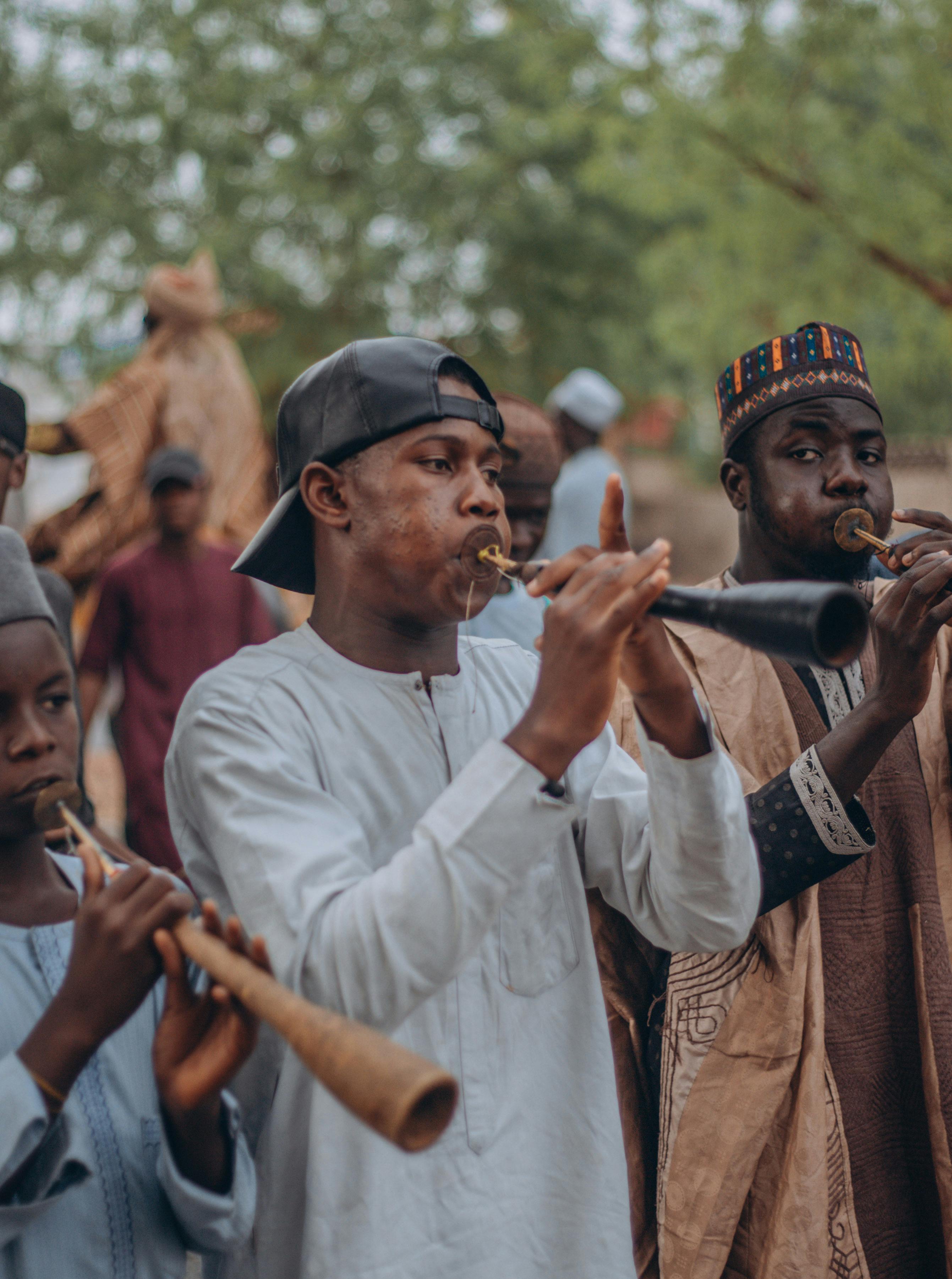 Traditional African Musicians Playing Wind Instruments · Free Stock Photo