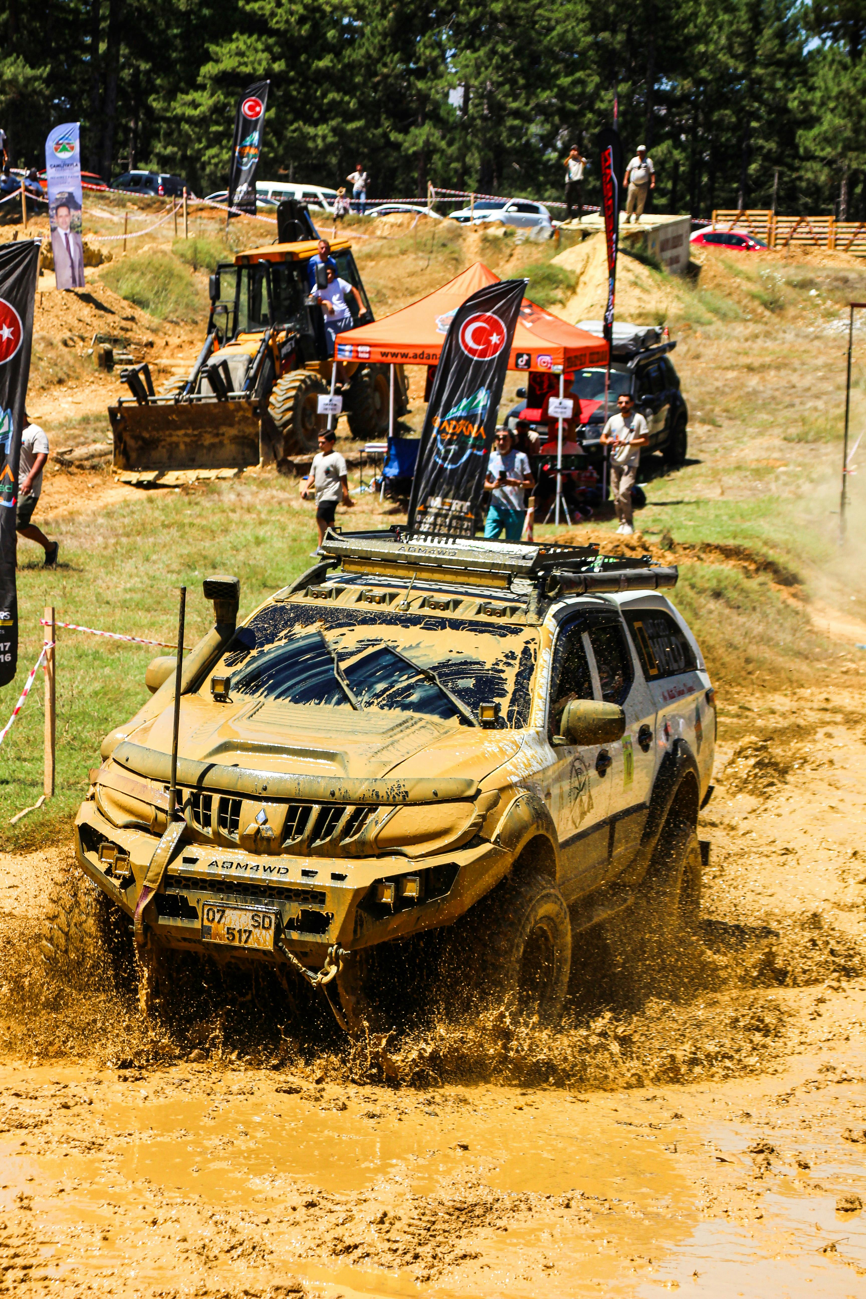 Off-Road Vehicle Rally in Muddy Terrain · Free Stock Photo