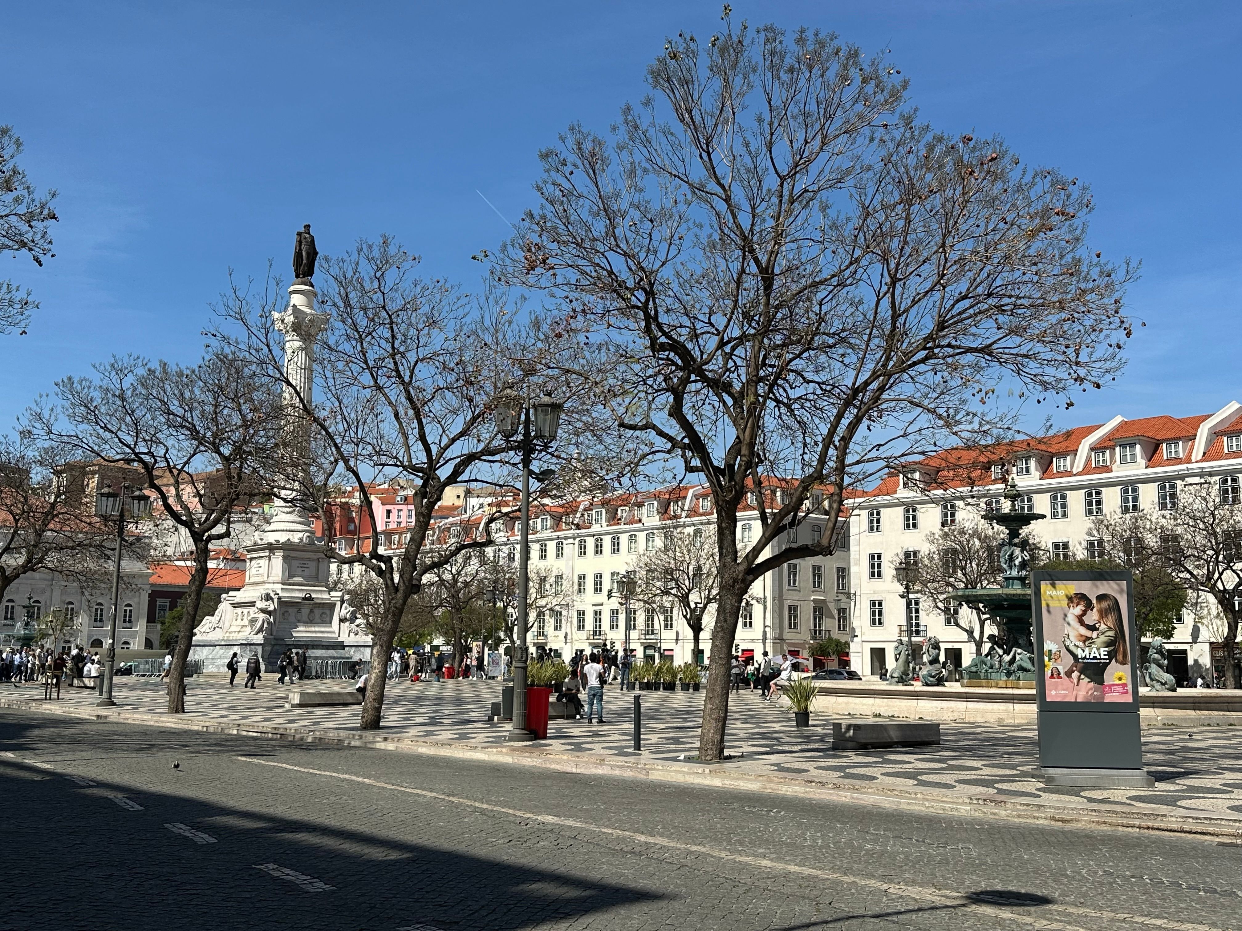 Lisbon's Rossio Square with Column and Statues · Free Stock Photo