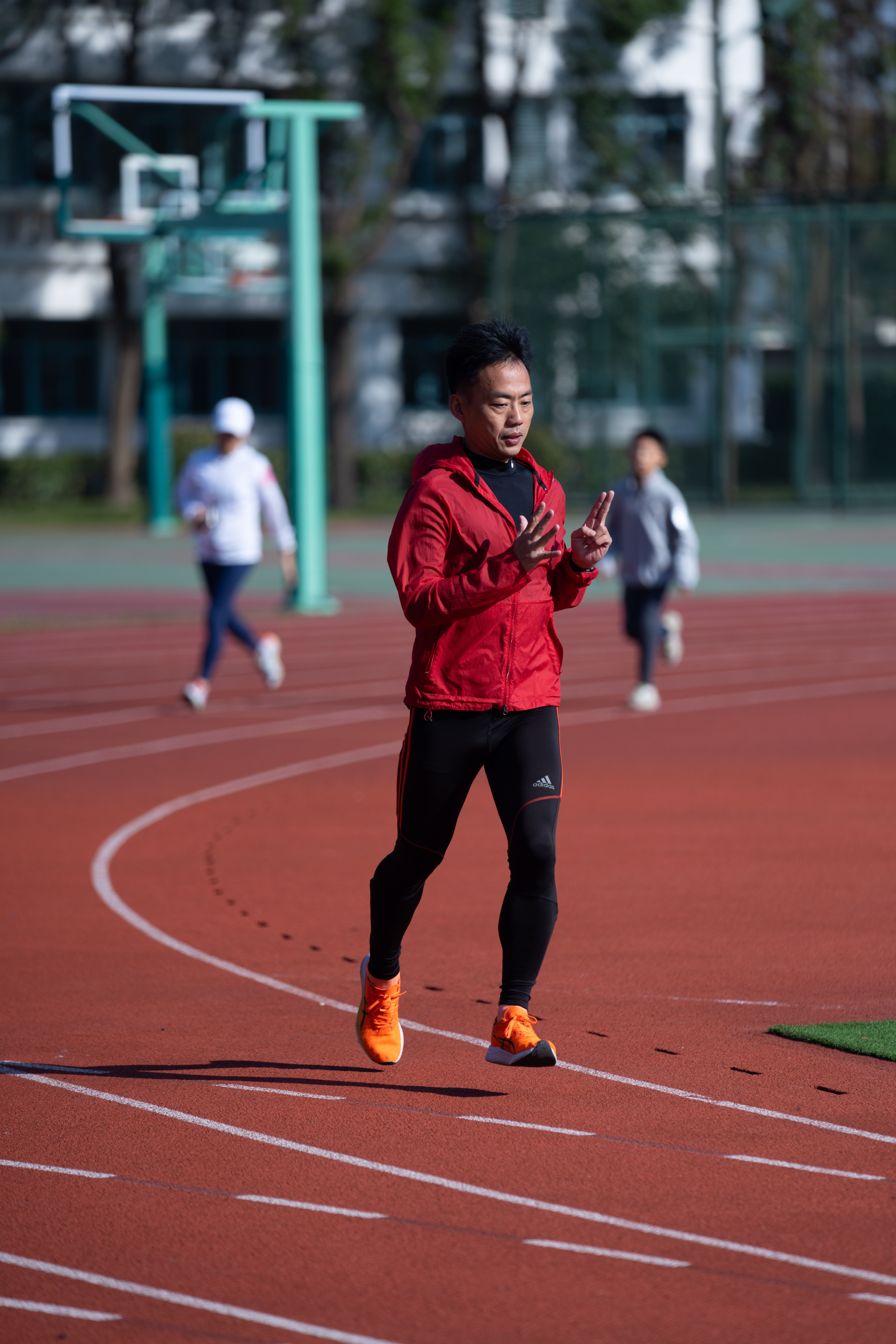 Young Man Jogging on Outdoor Track During Daytime · Free Stock Photo