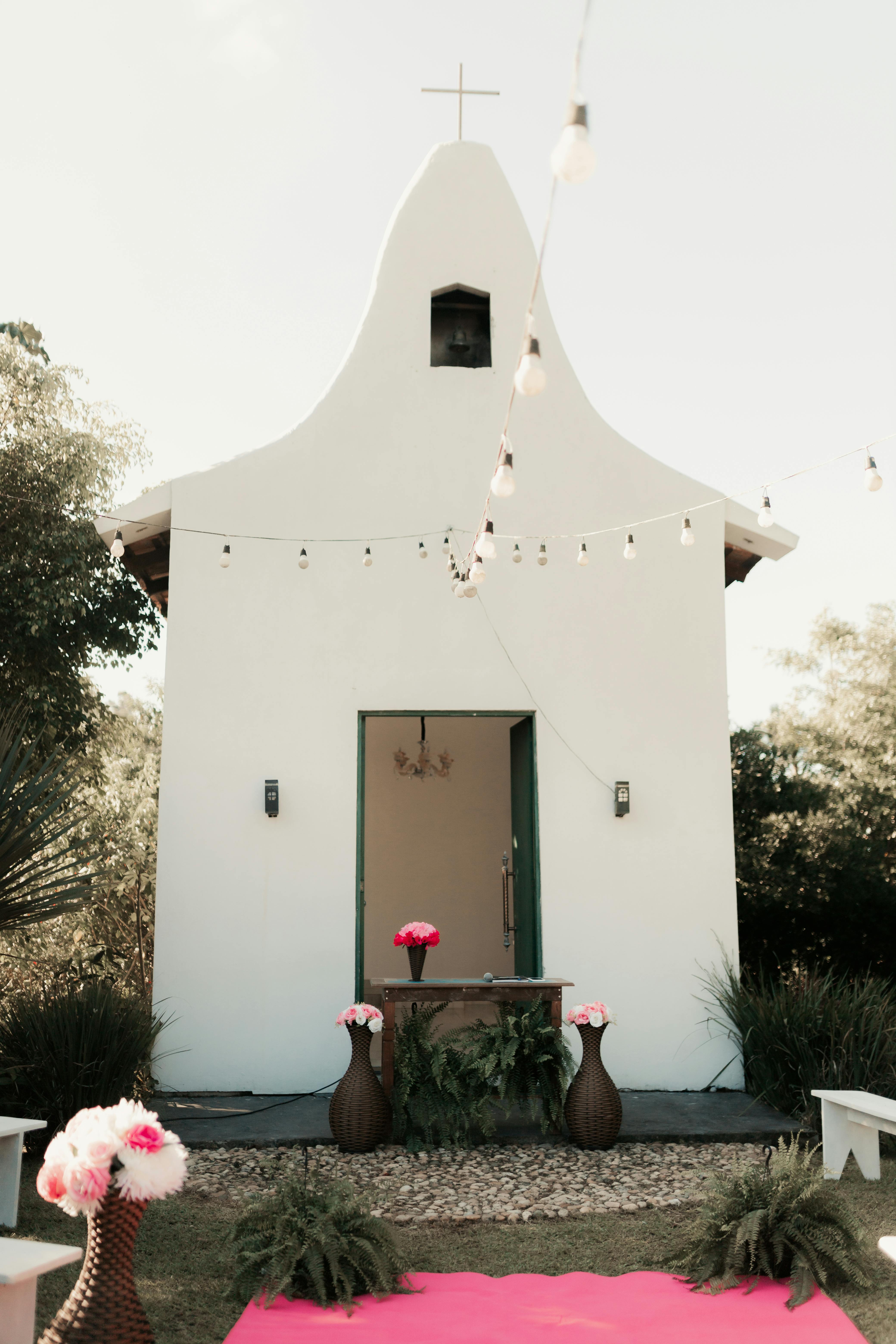 Charming White Chapel with Outdoor Decor · Free Stock Photo