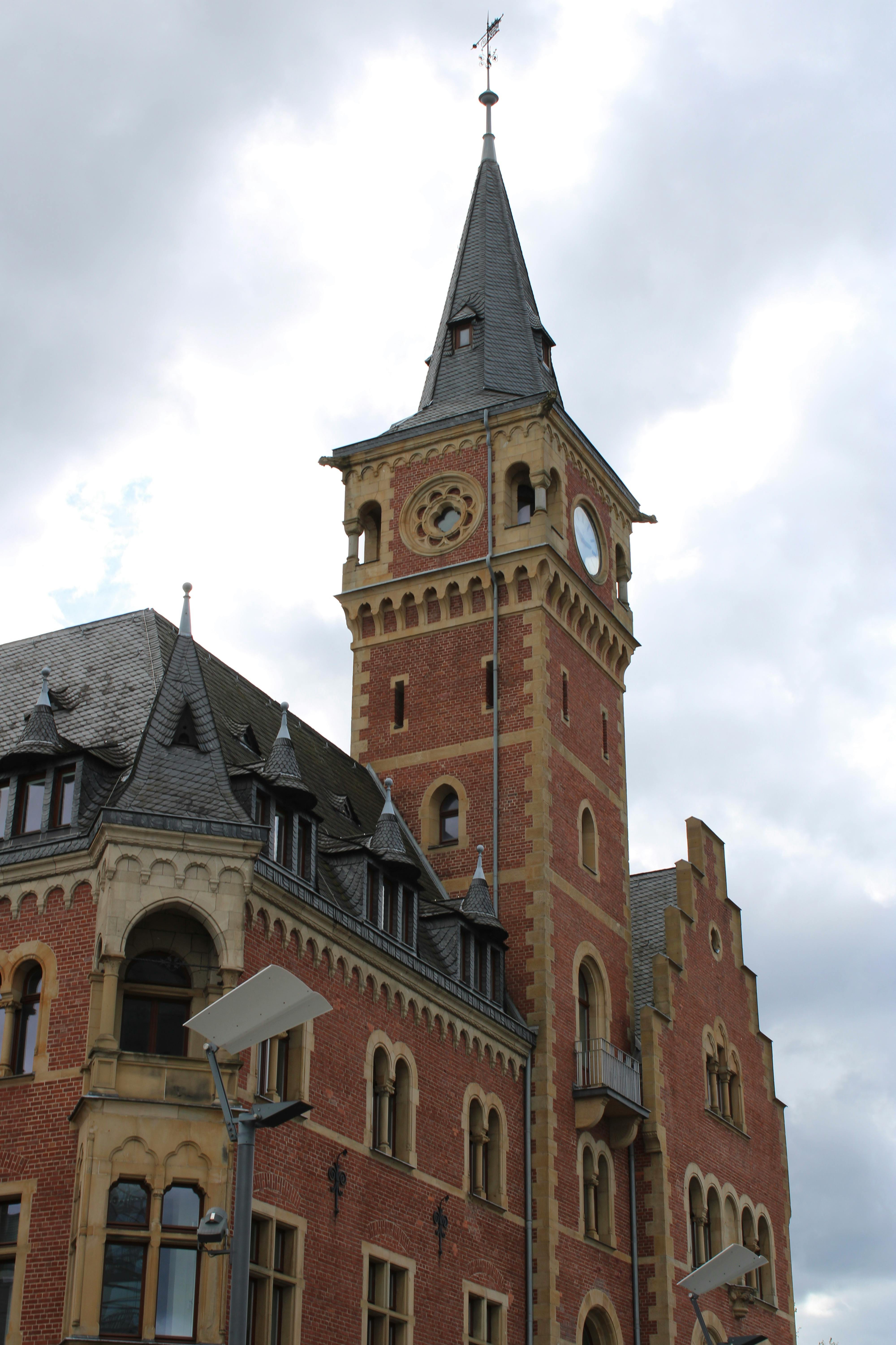 Historic European Clock Tower Against Cloudy Sky · Free Stock Photo
