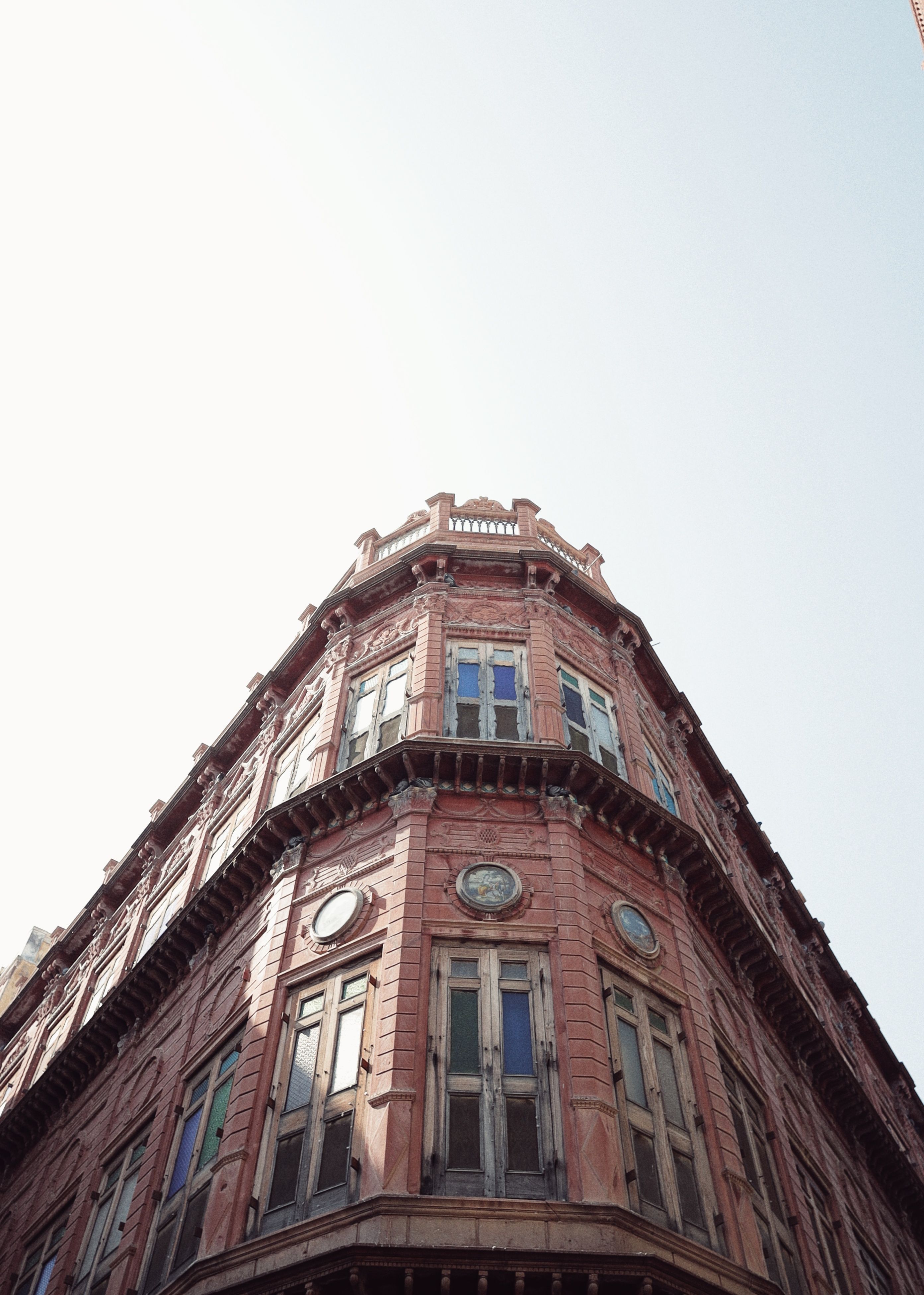 Historic Red Brick Building with Blue Sky · Free Stock Photo