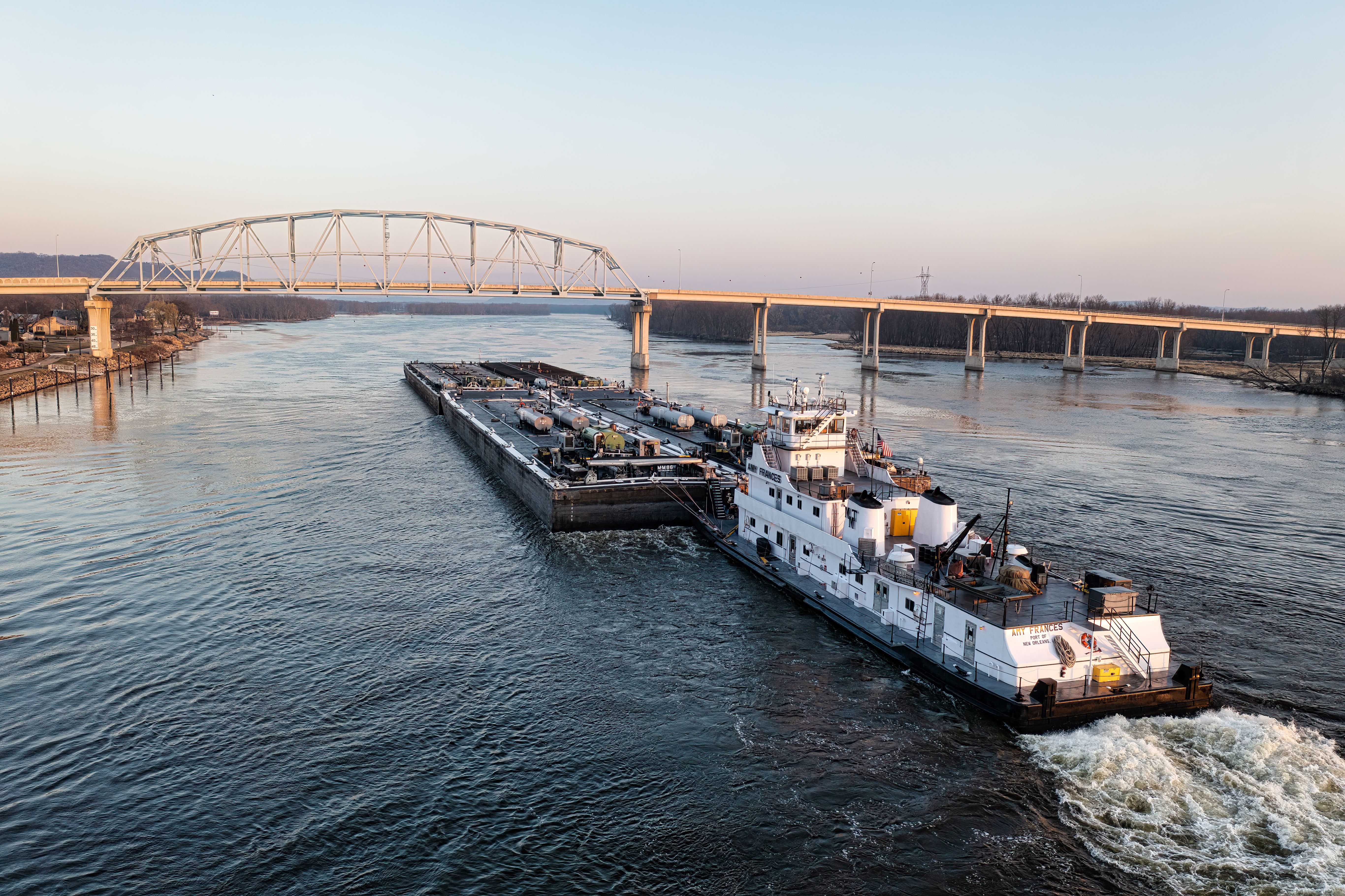 Barge Navigating Under Wabasha Bridge at Sunset · Free Stock Photo