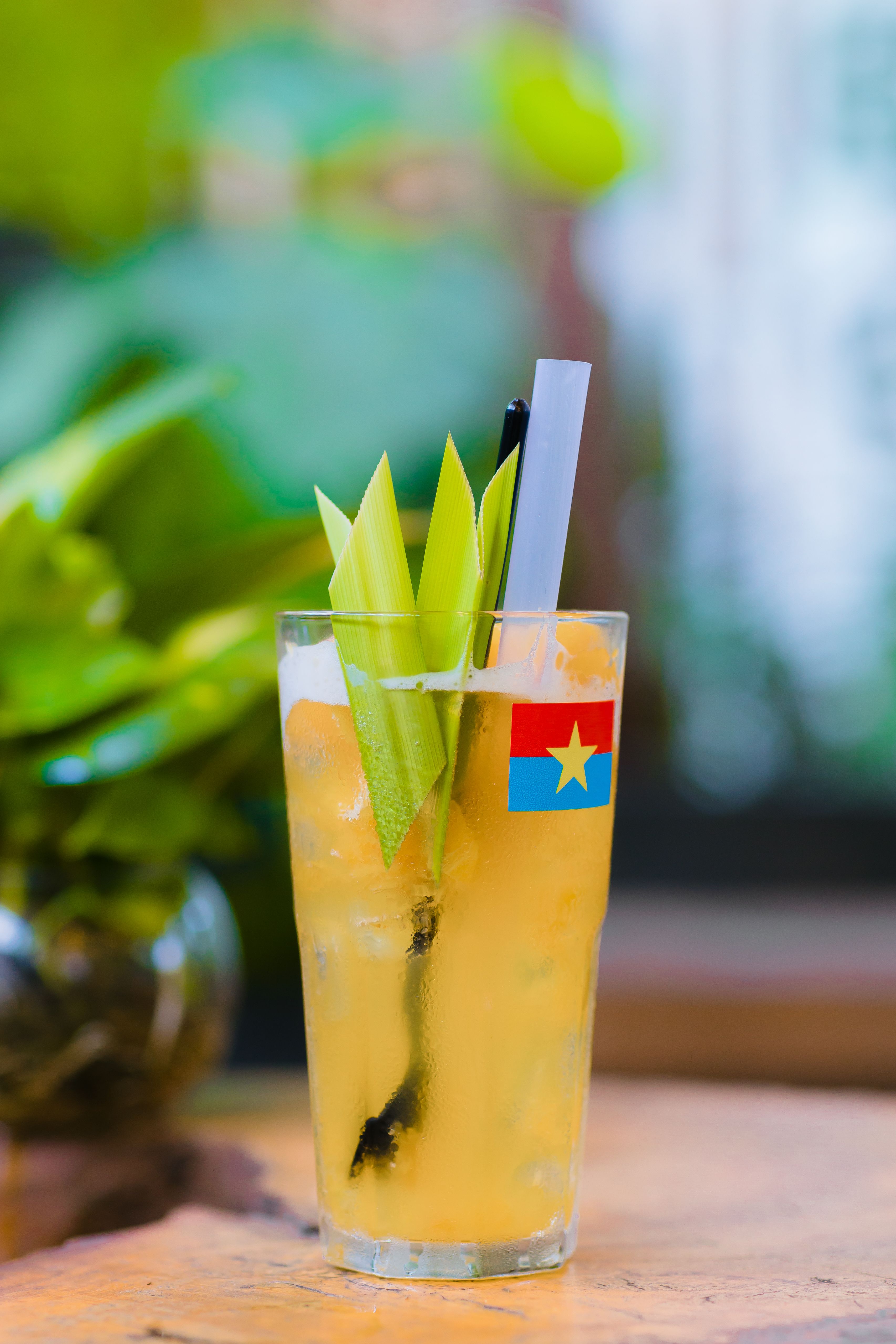 Refreshing Iced Beverage with Flag Decoration · Free Stock Photo
