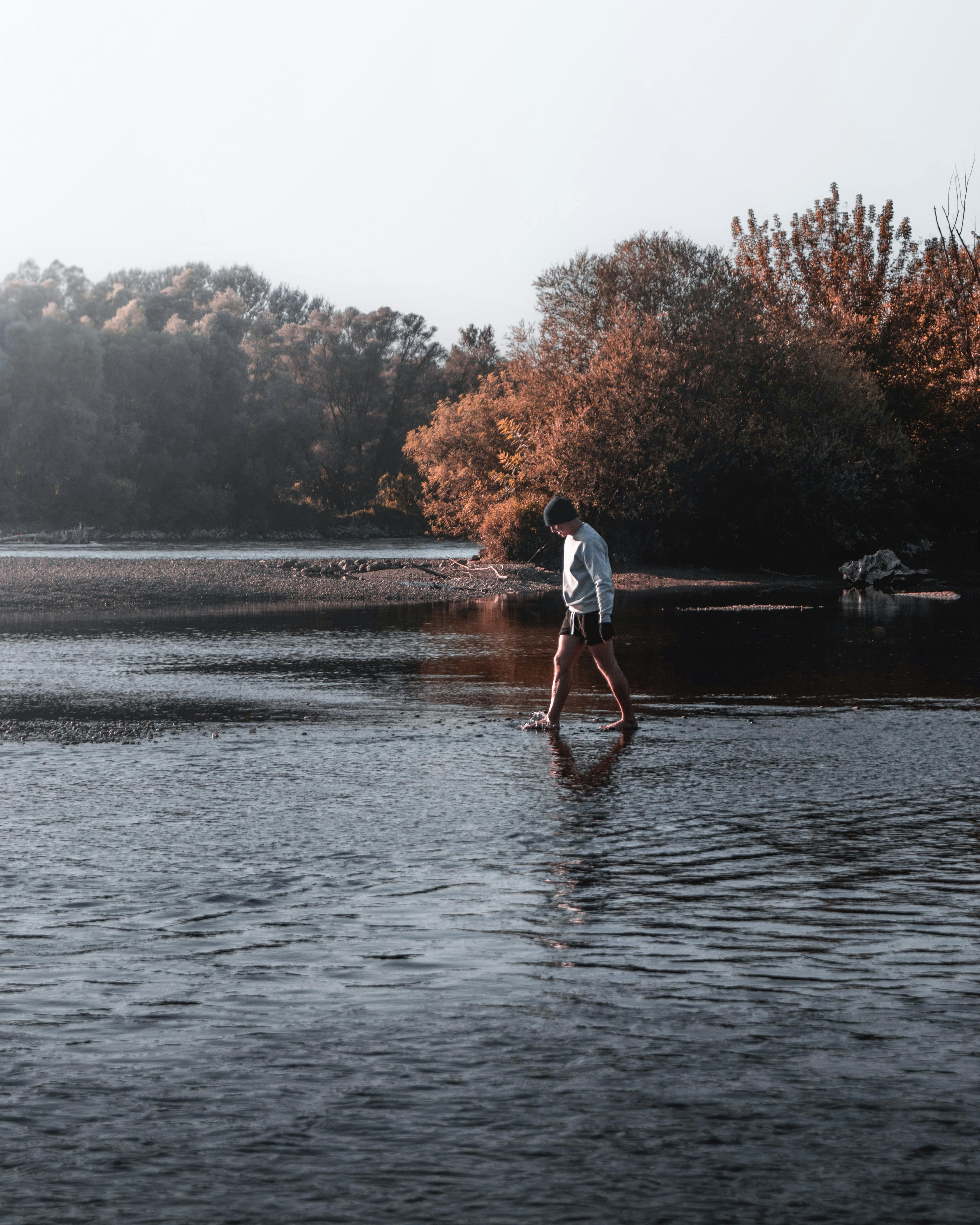 Person Walking in Water · Free Stock Photo