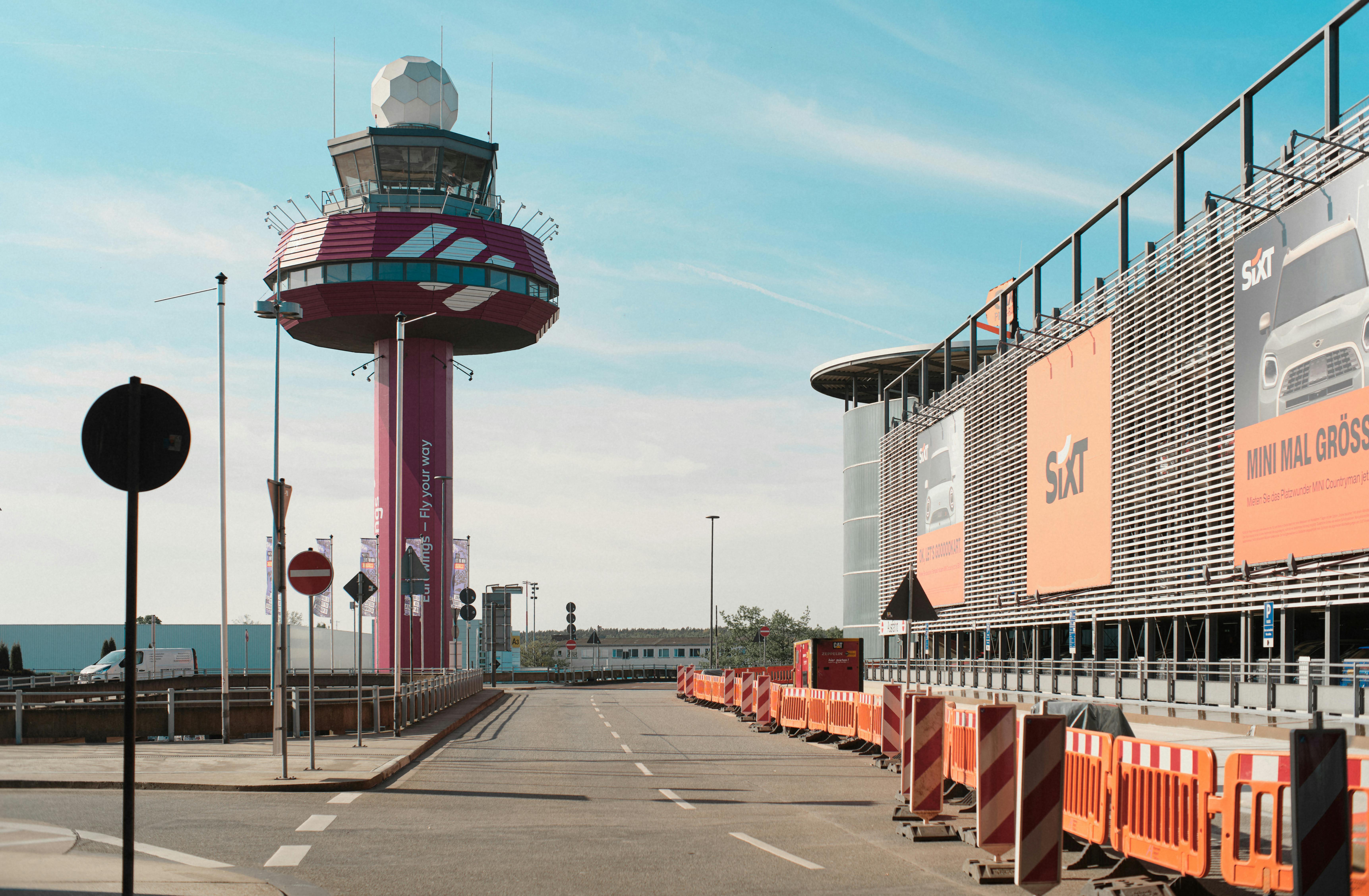 Vibrant Air Control Tower and Sixt Ad Display · Free Stock Photo