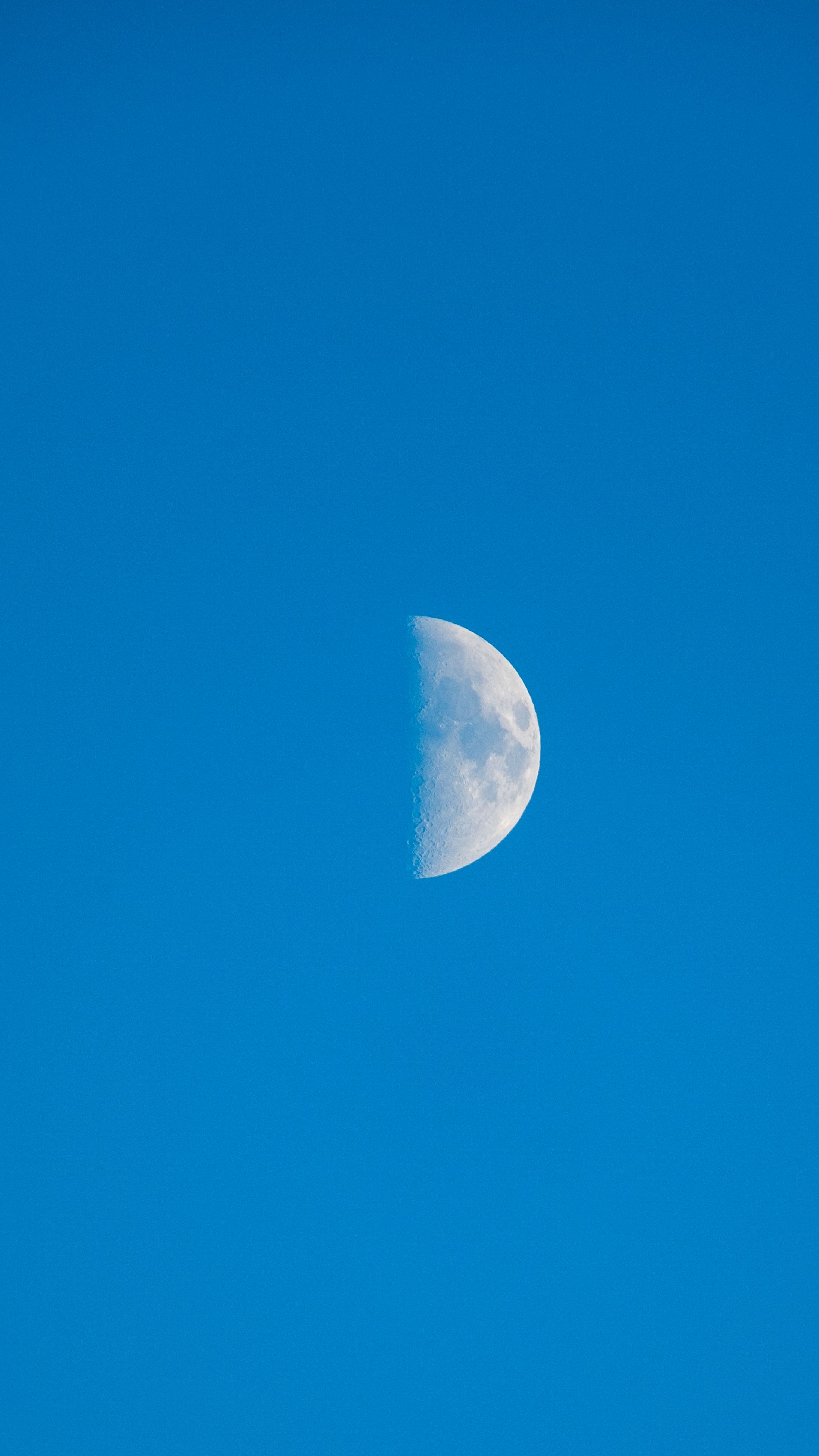 Half Moon Against Clear Blue Sky · Free Stock Photo