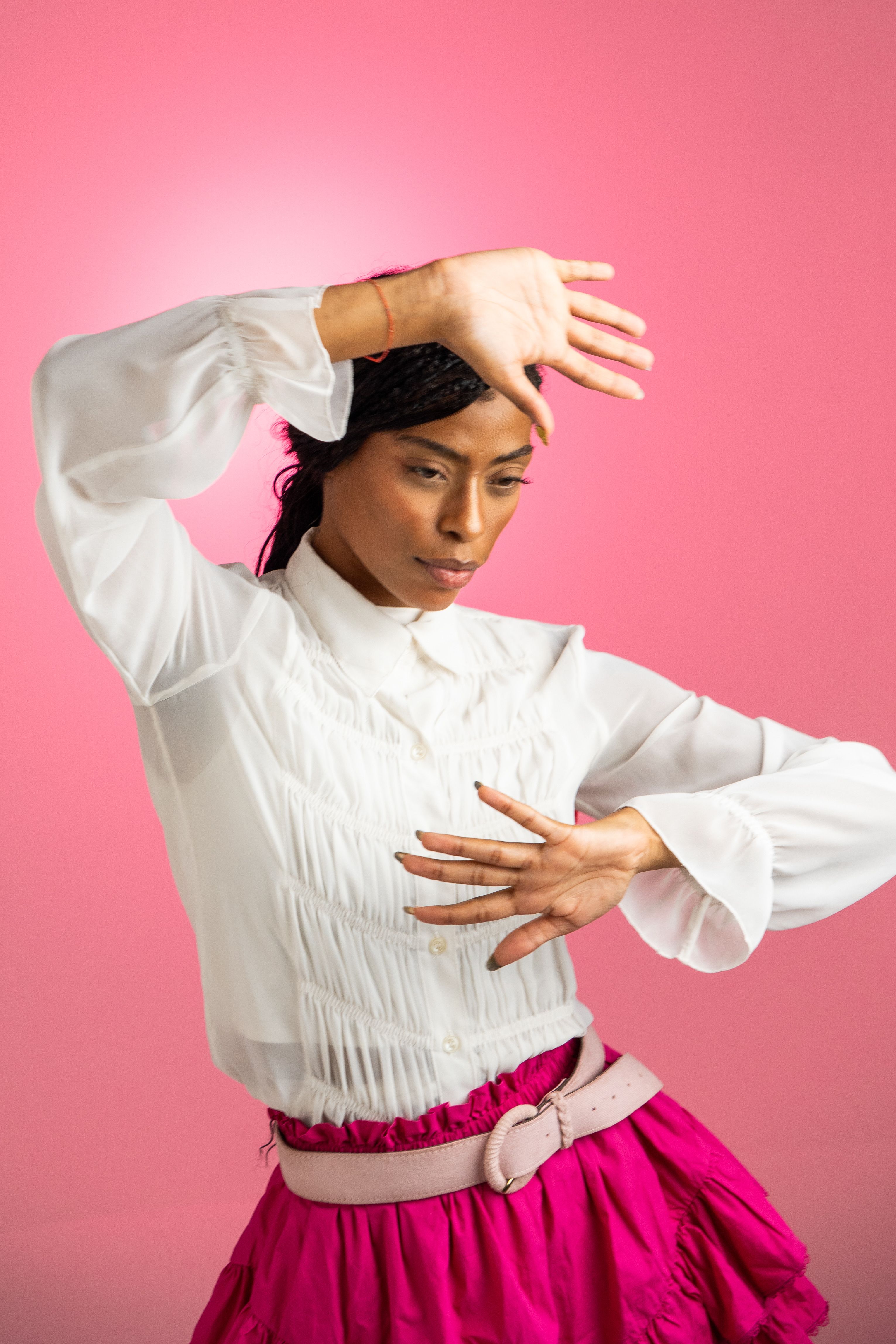 Expressive Dance Pose with Vibrant Pink Background · Free Stock Photo