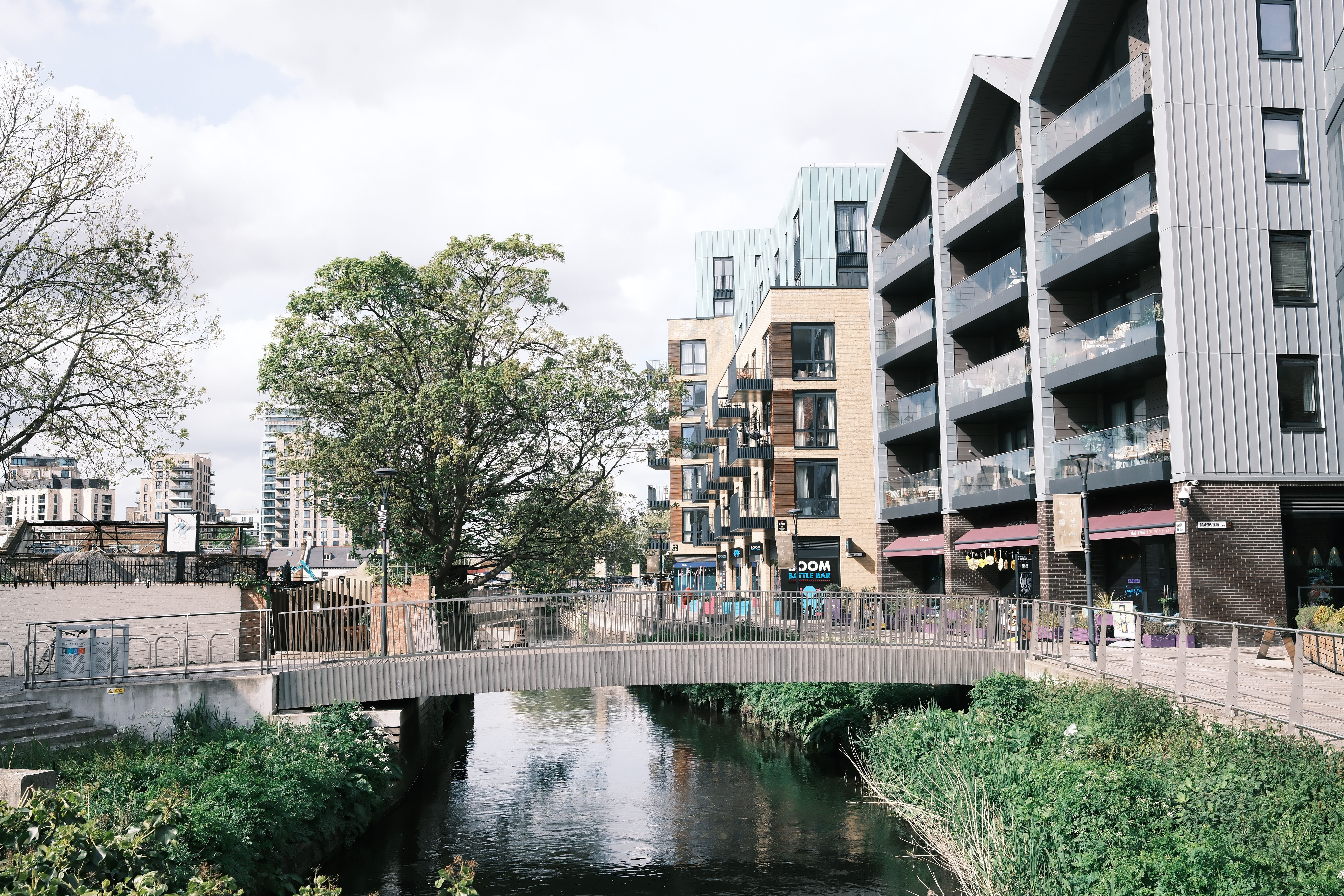 Modern Urban Apartment Buildings by a River · Free Stock Photo