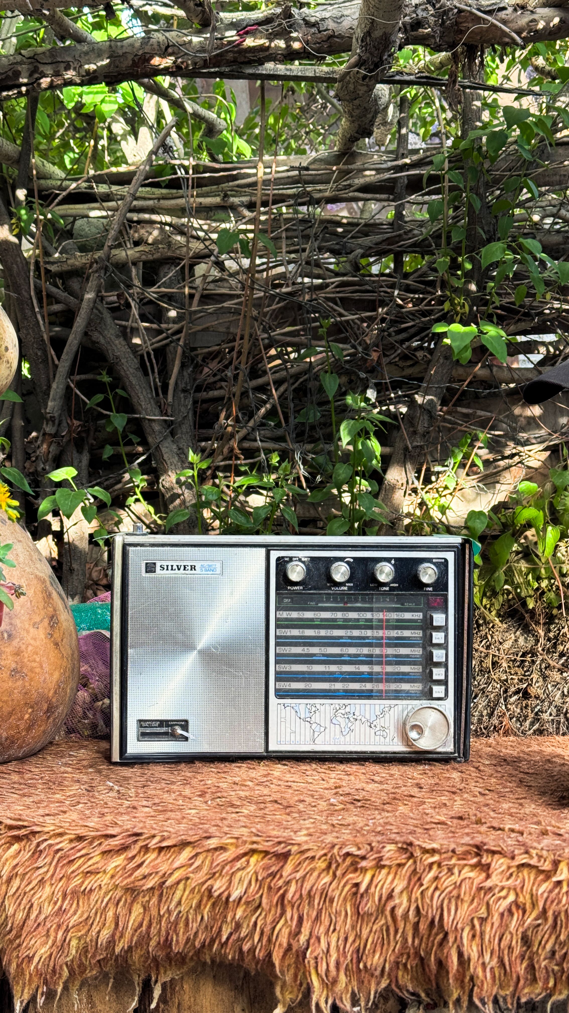 Vintage Radio in Rustic Outdoor Setting · Free Stock Photo