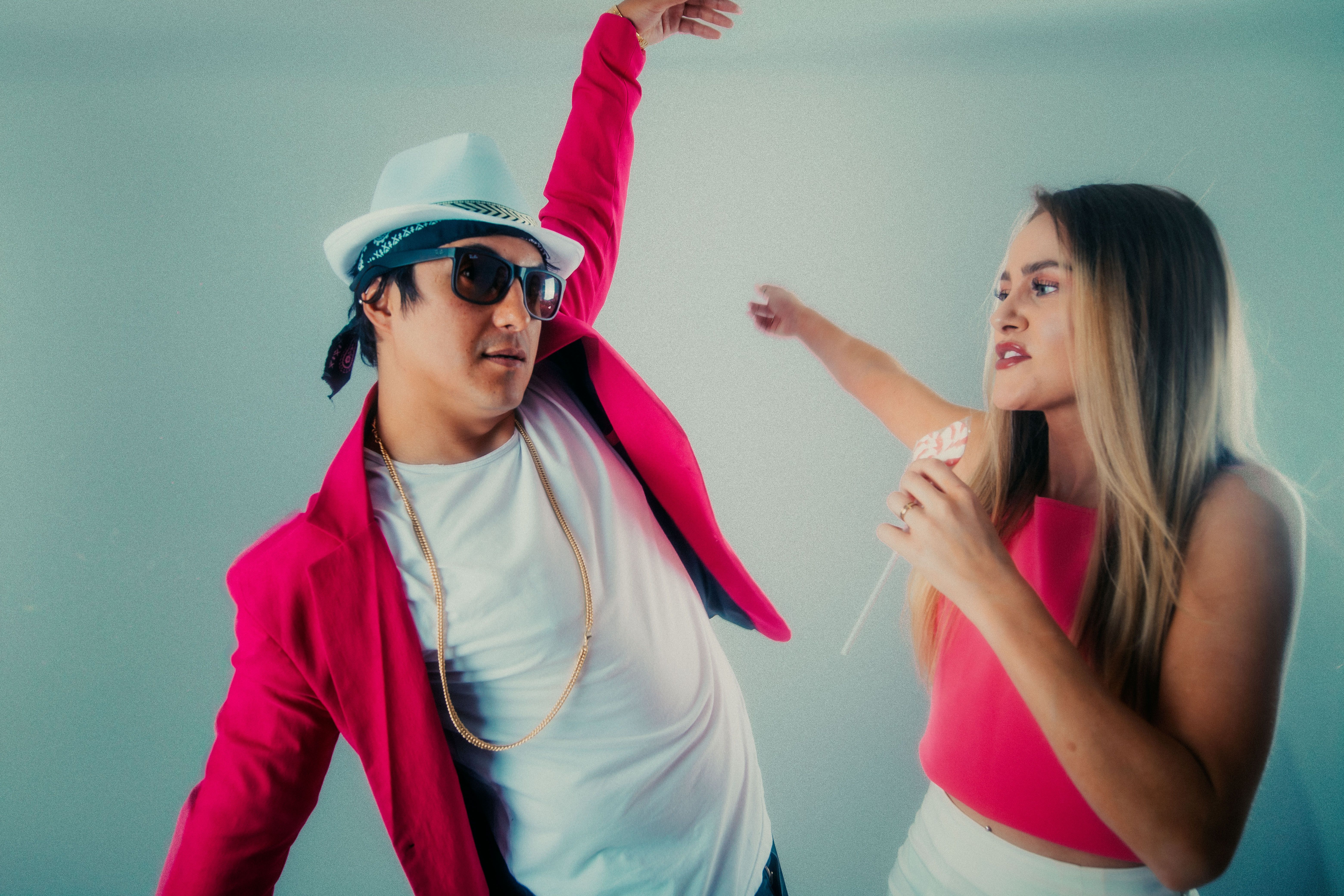 Stylish Duo Dancing in Pink Outfits · Free Stock Photo