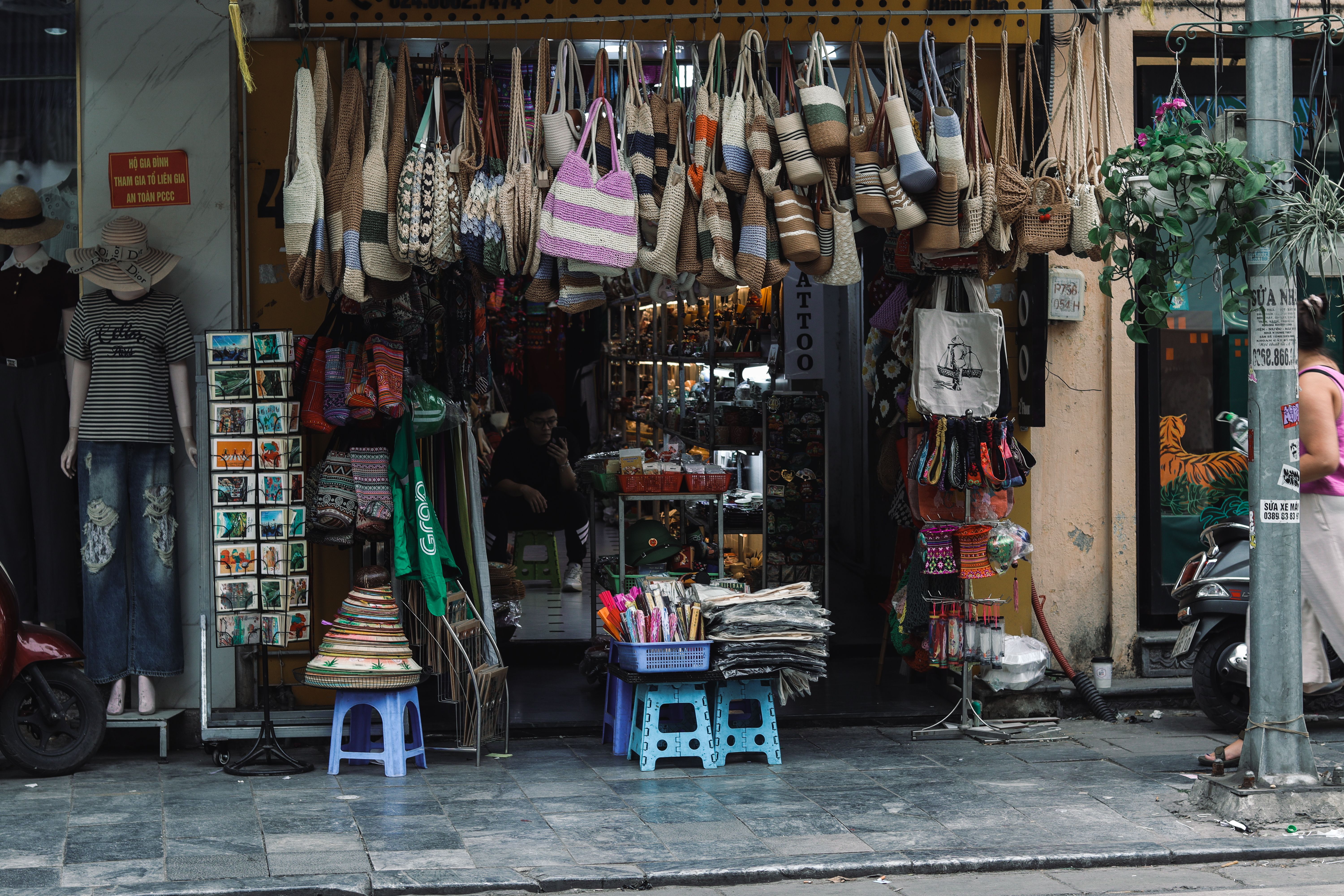 Vibrant Street Market Stall Displaying Handcrafted Goods · Free Stock Photo