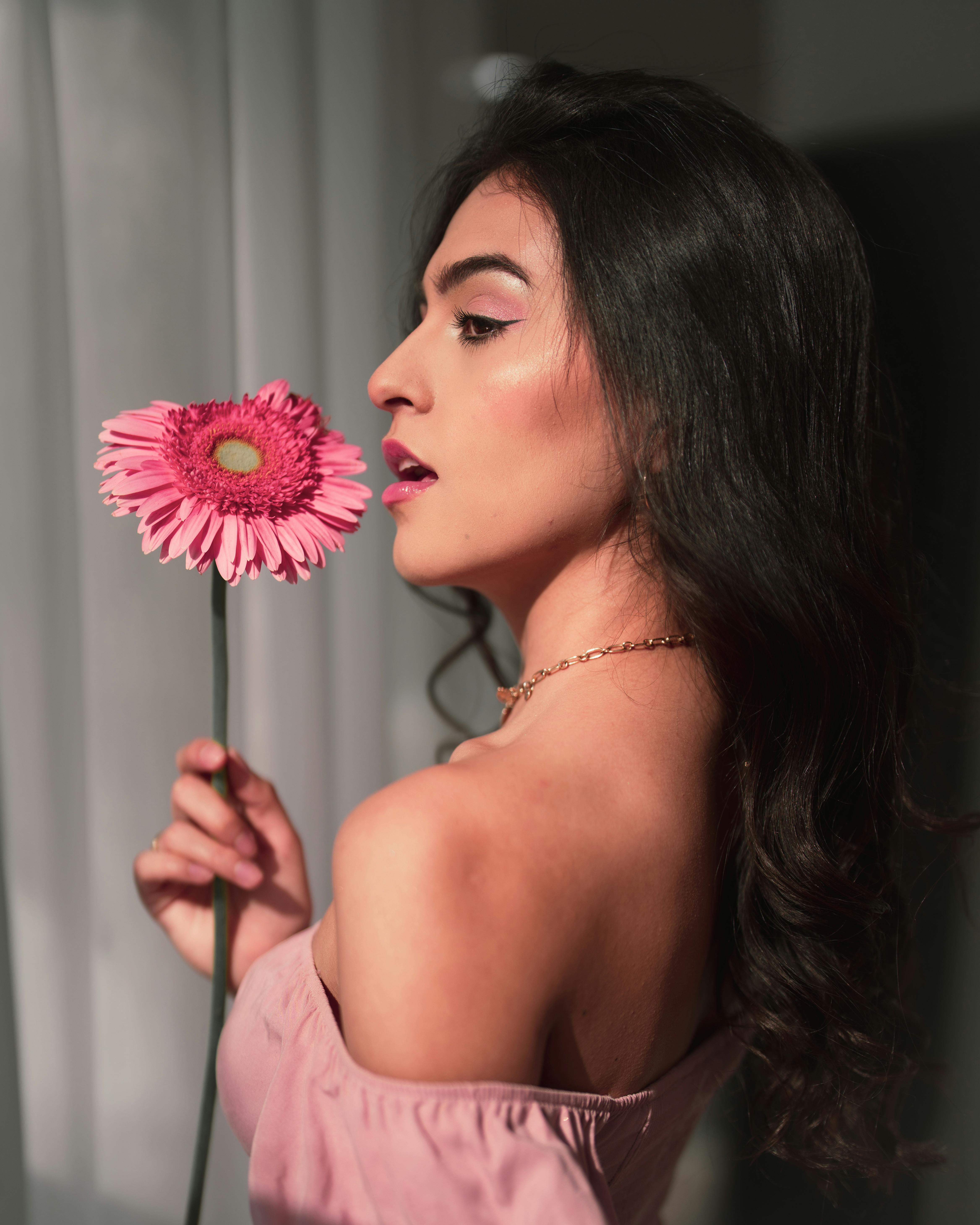 Elegant Portrait with Pink Gerbera Flower · Free Stock Photo