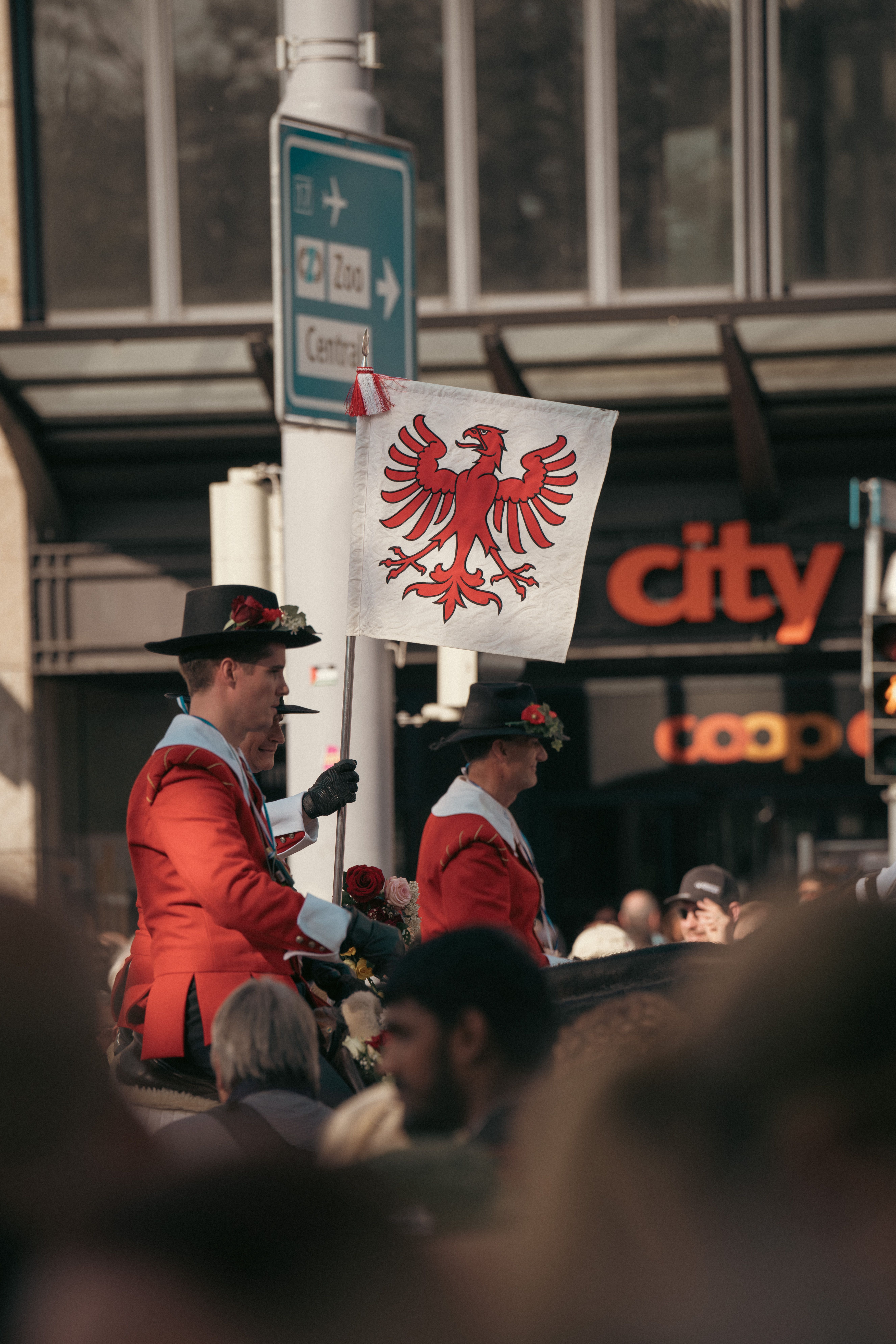 Traditional Parade with Red Eagle Flag in City · Free Stock Photo
