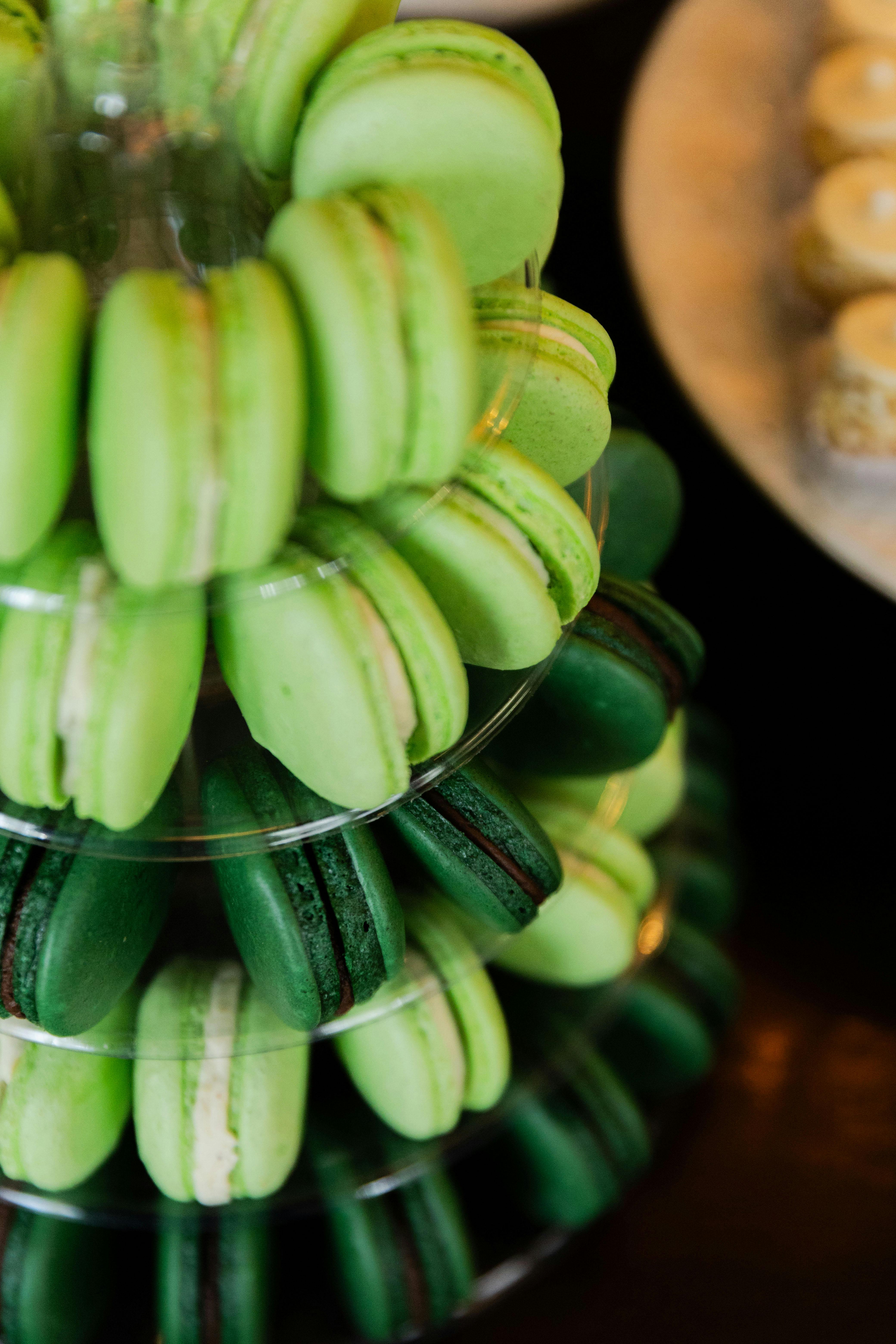 Green Macarons on Tiered Display at Event · Free Stock Photo