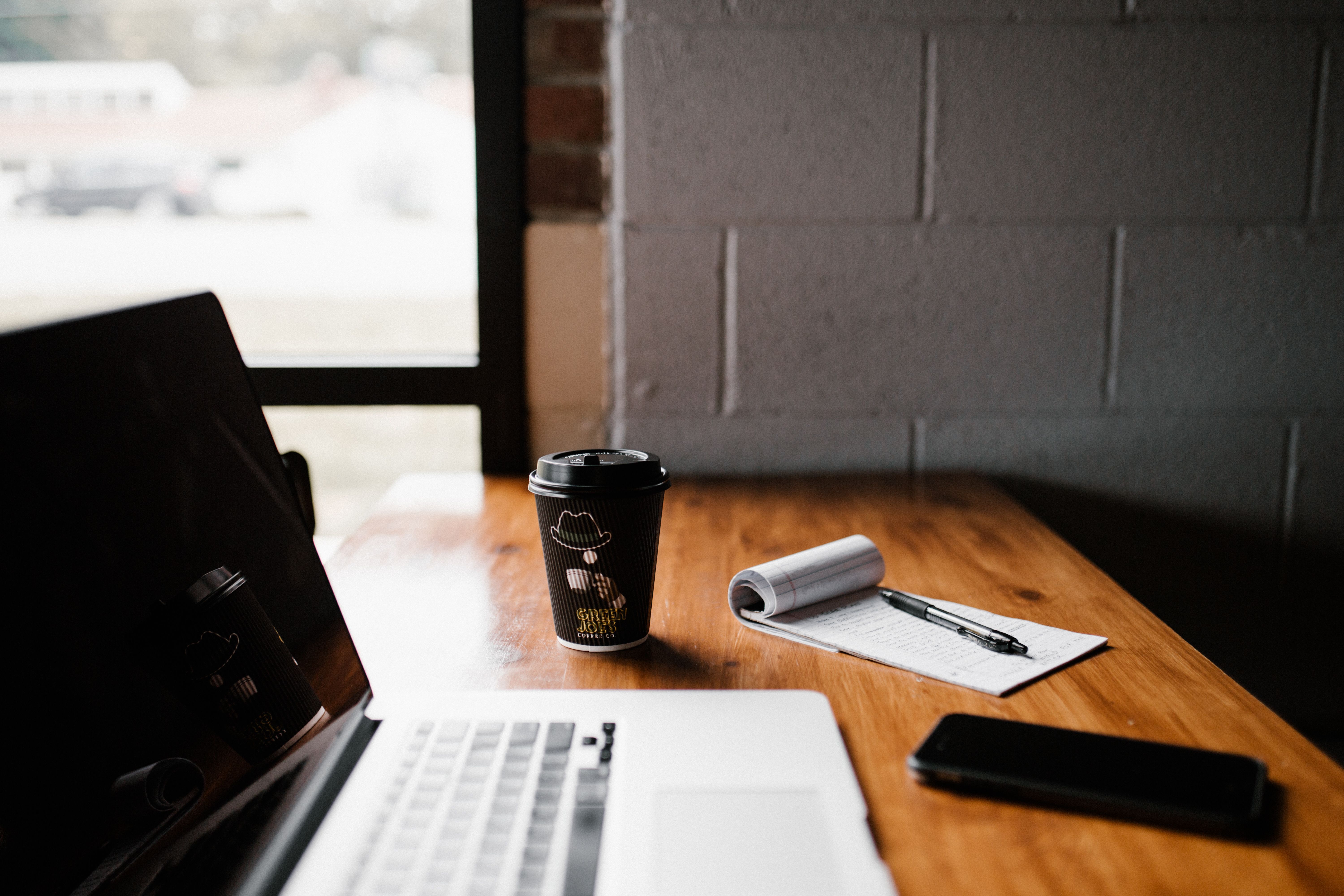 Workspace with Coffee and Laptop in Greensboro · Free Stock Photo