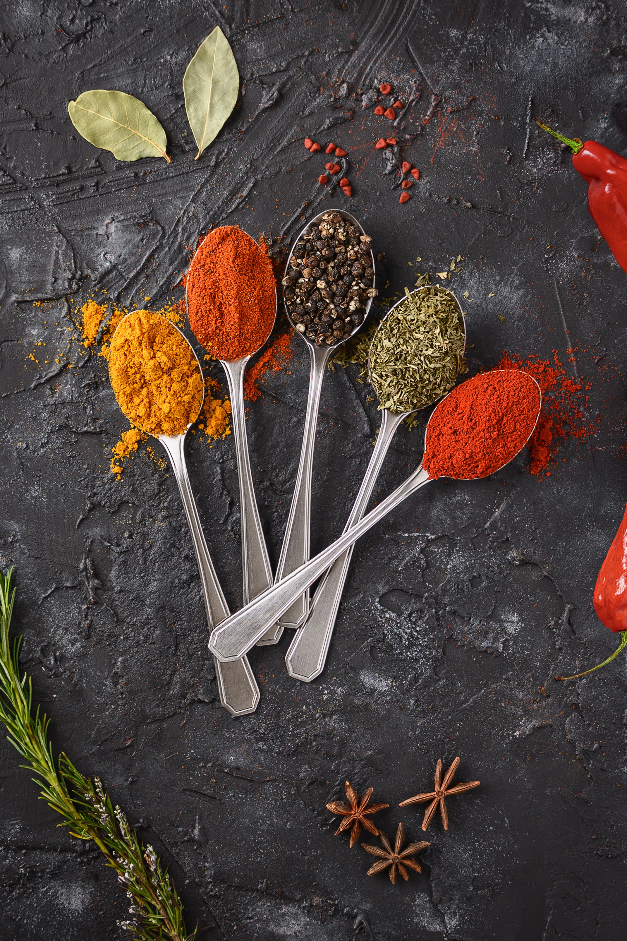 Colorful Assortment of Spices on Dark Background · Free Stock Photo