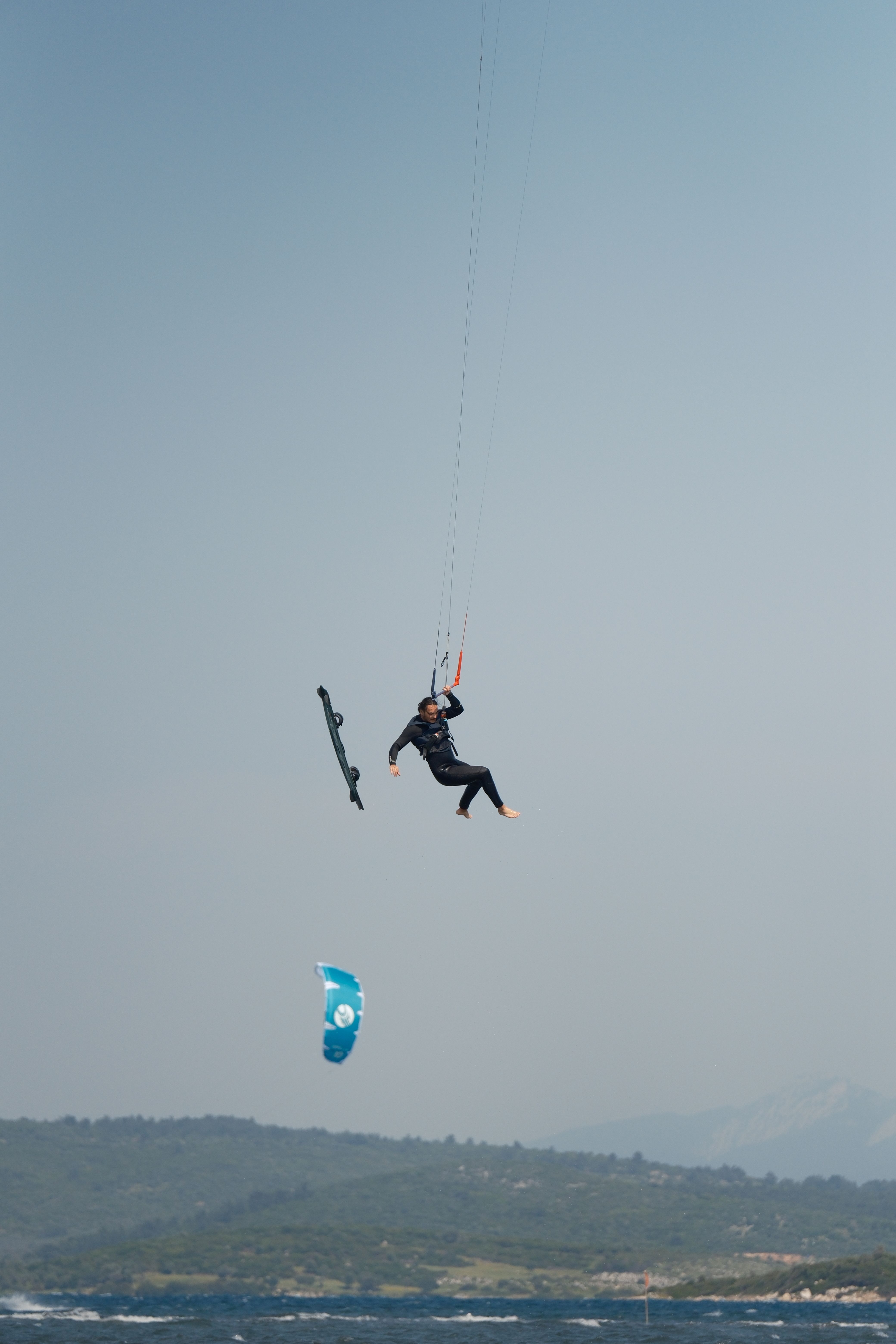 Kitesurfer Performing Aerial Stunt Over Ocean · Free Stock Photo