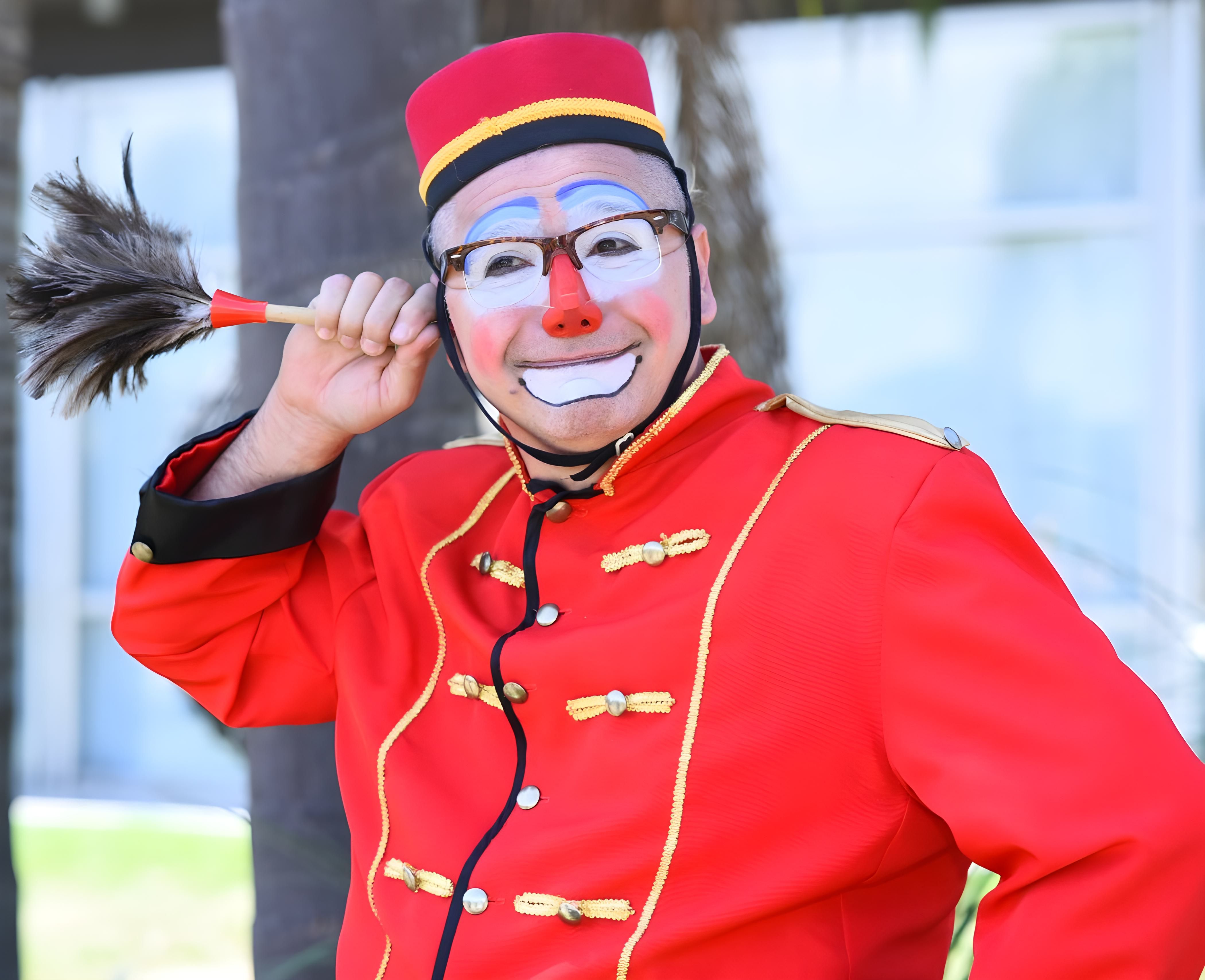 Brightly Dressed Circus Clown with Cheerful Expression · Free Stock Photo