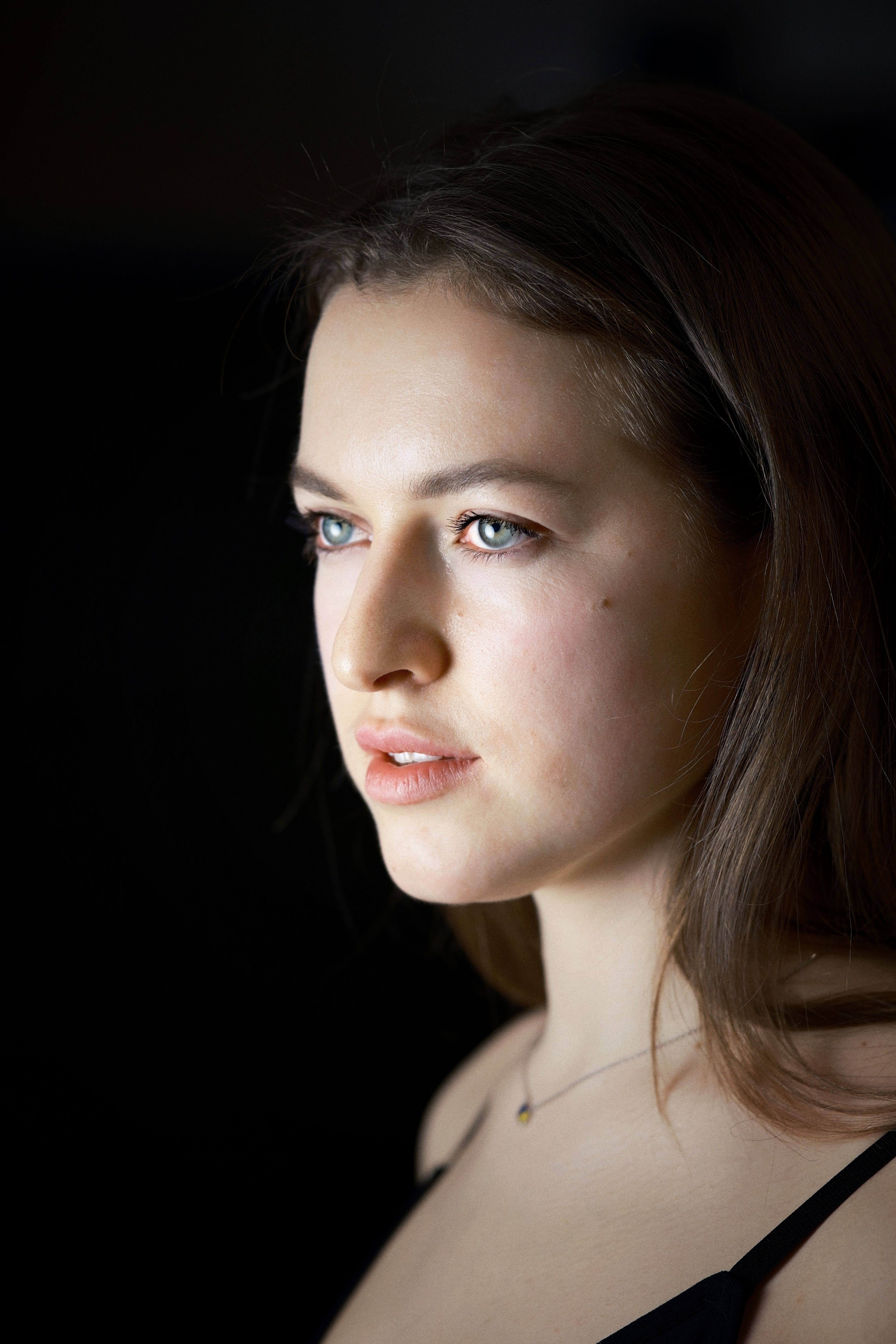 Young Woman Portrait with Dramatic Lighting · Free Stock Photo