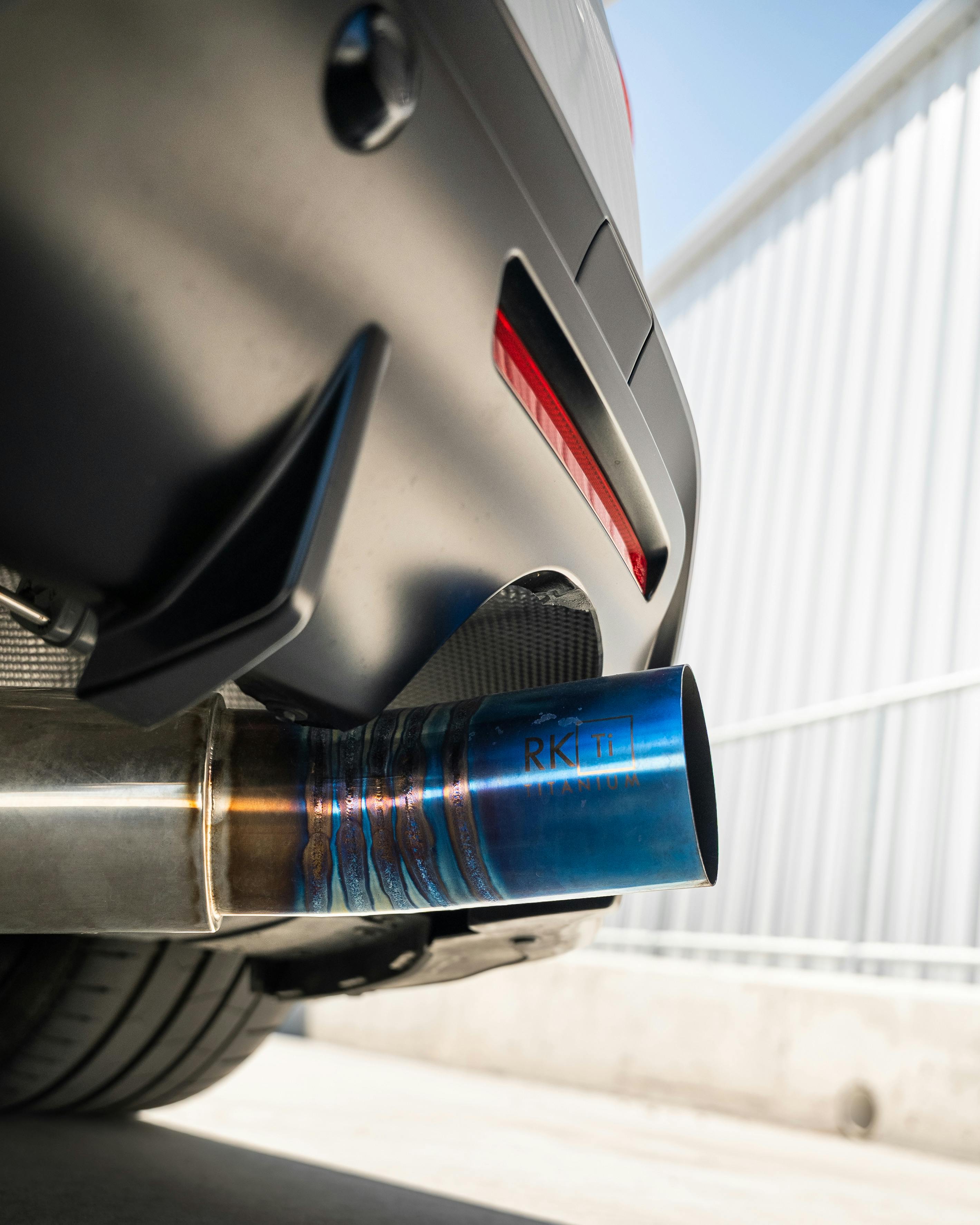 Close-up of Sports Car Exhaust on Sunny Day · Free Stock Photo