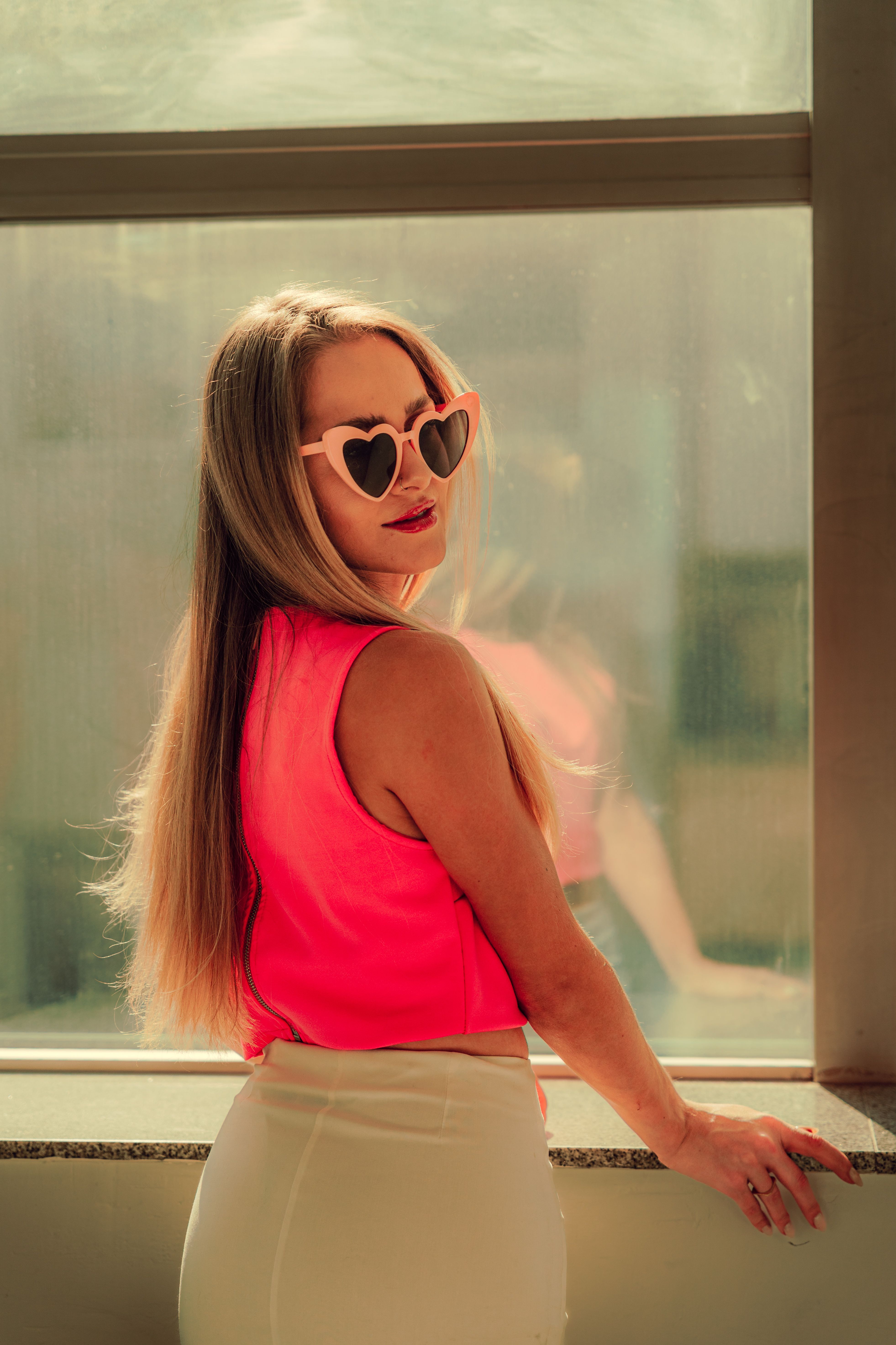 Fashionable Woman in Sunglasses by Window · Free Stock Photo