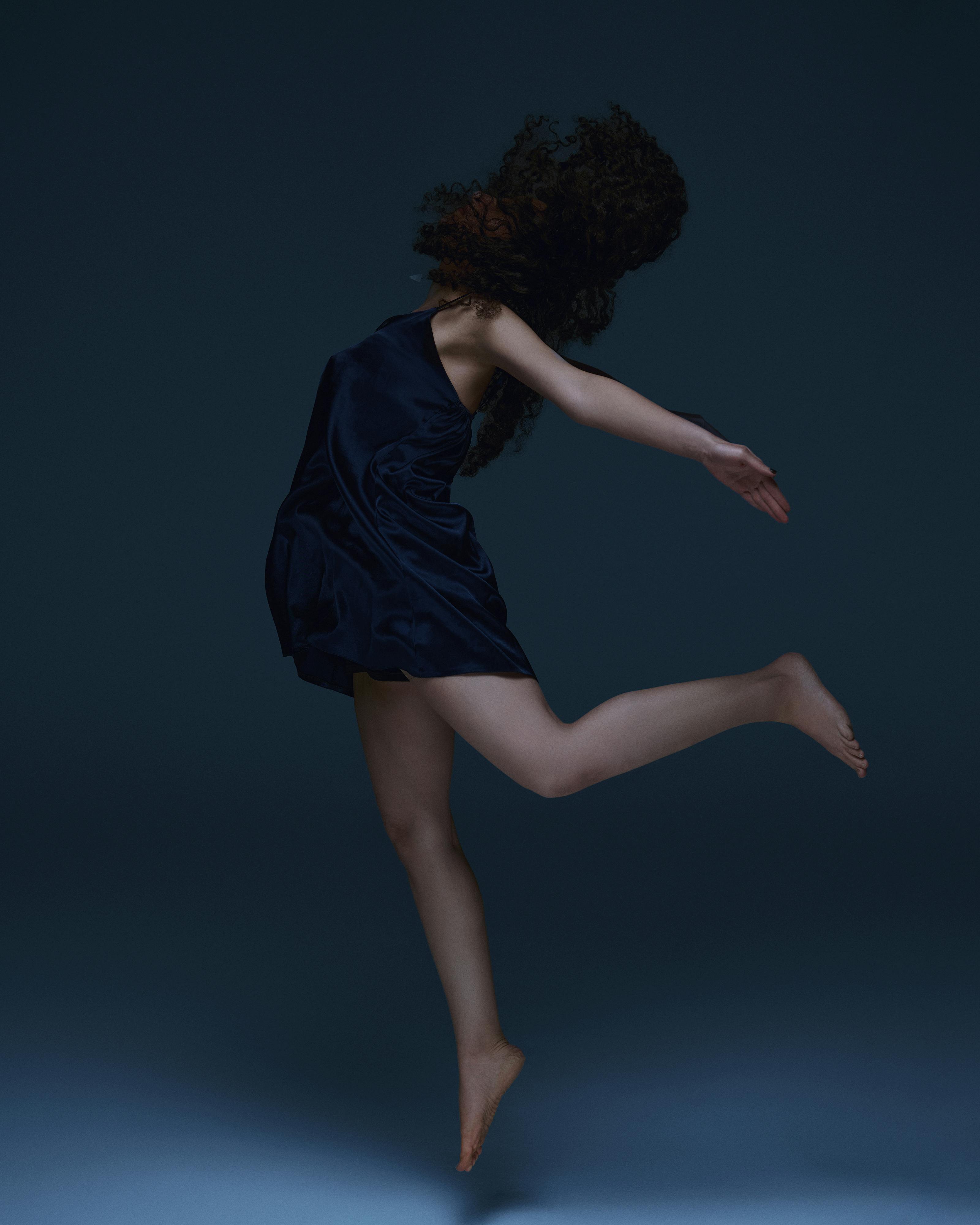 Dynamic Portrait of Levitating Woman in Blue Dress · Free Stock Photo