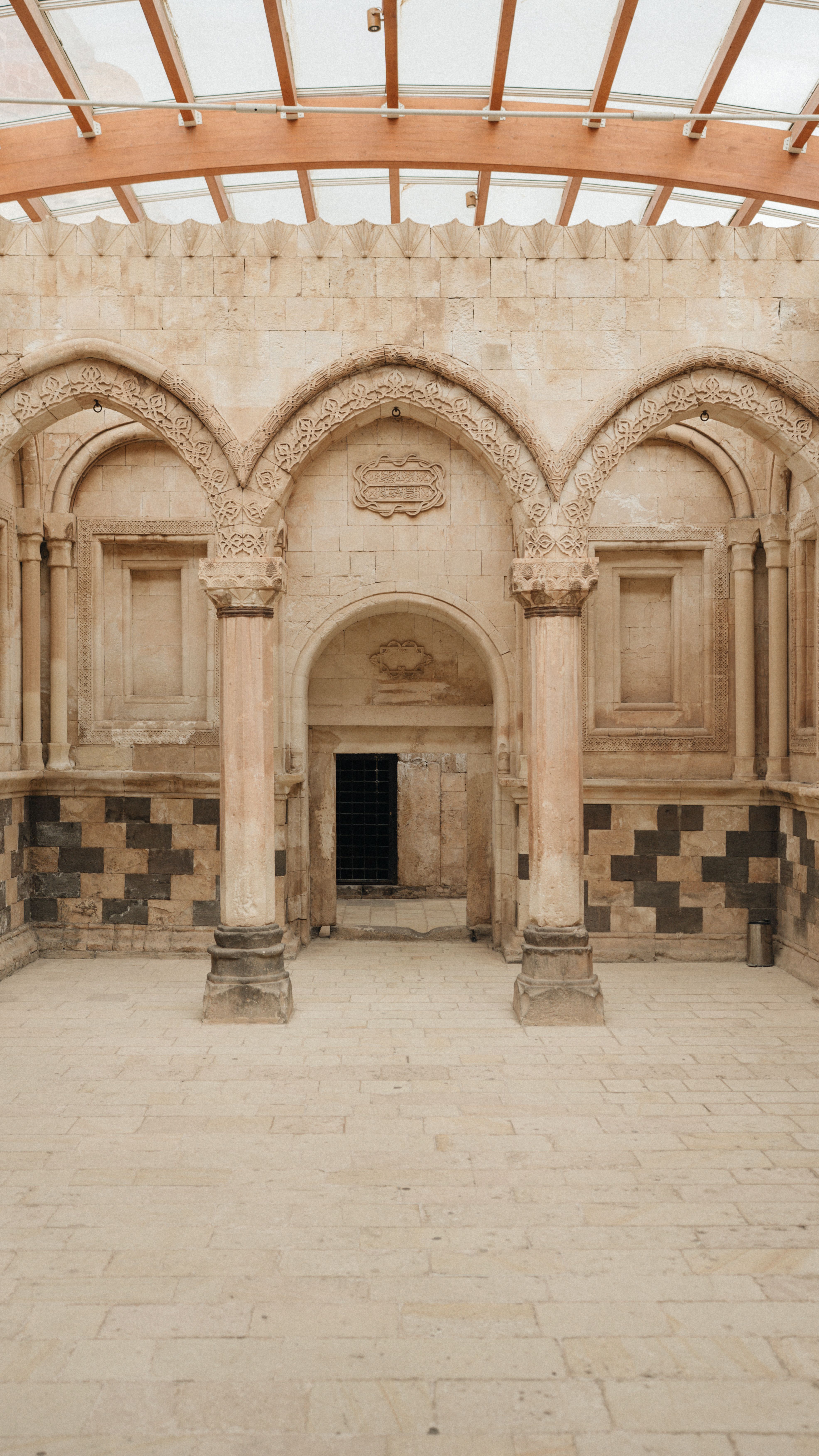 Ancient Stone Architecture with Arched Columns · Free Stock Photo