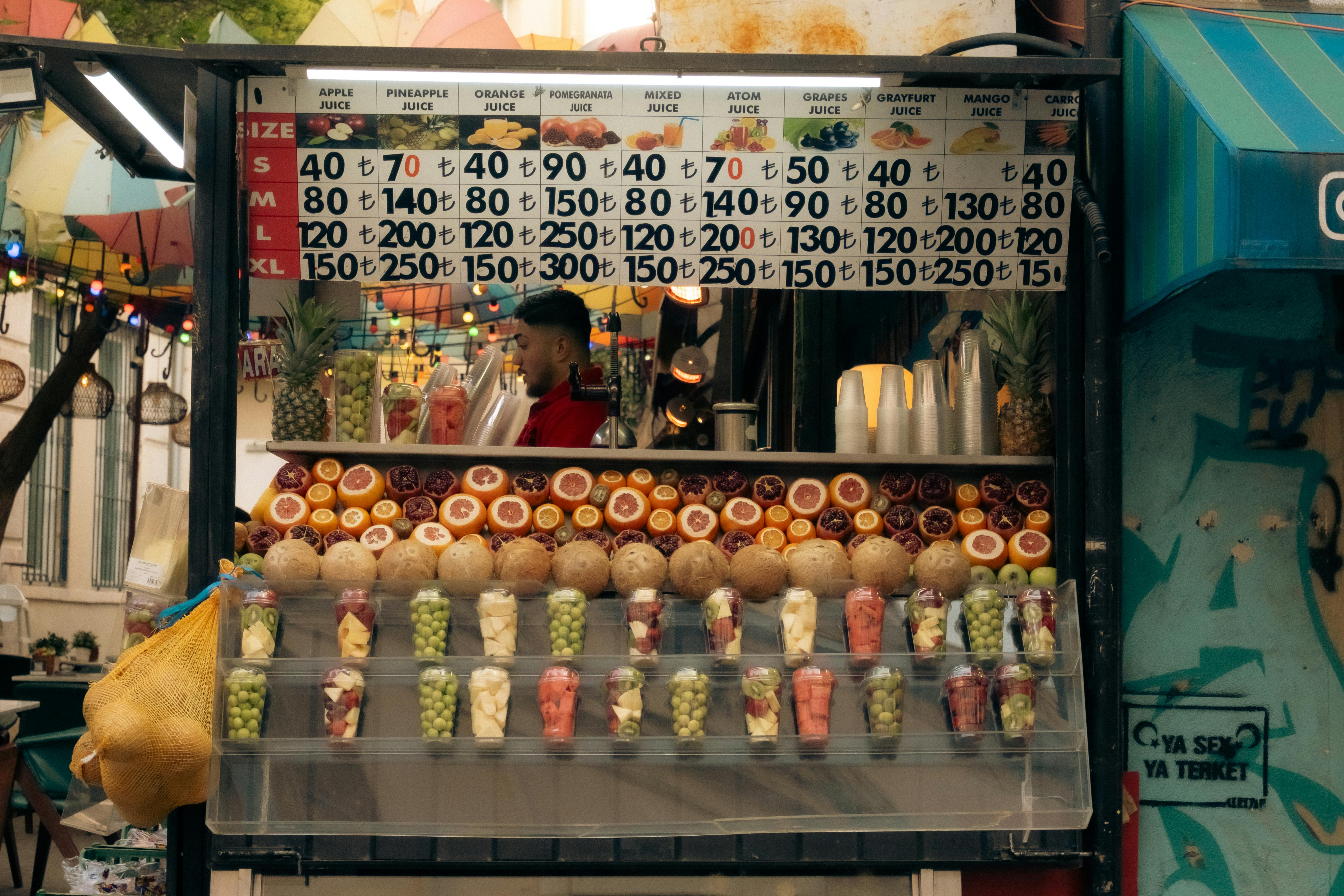 Colorful Street Juice Stand with Fresh Fruits · Free Stock Photo
