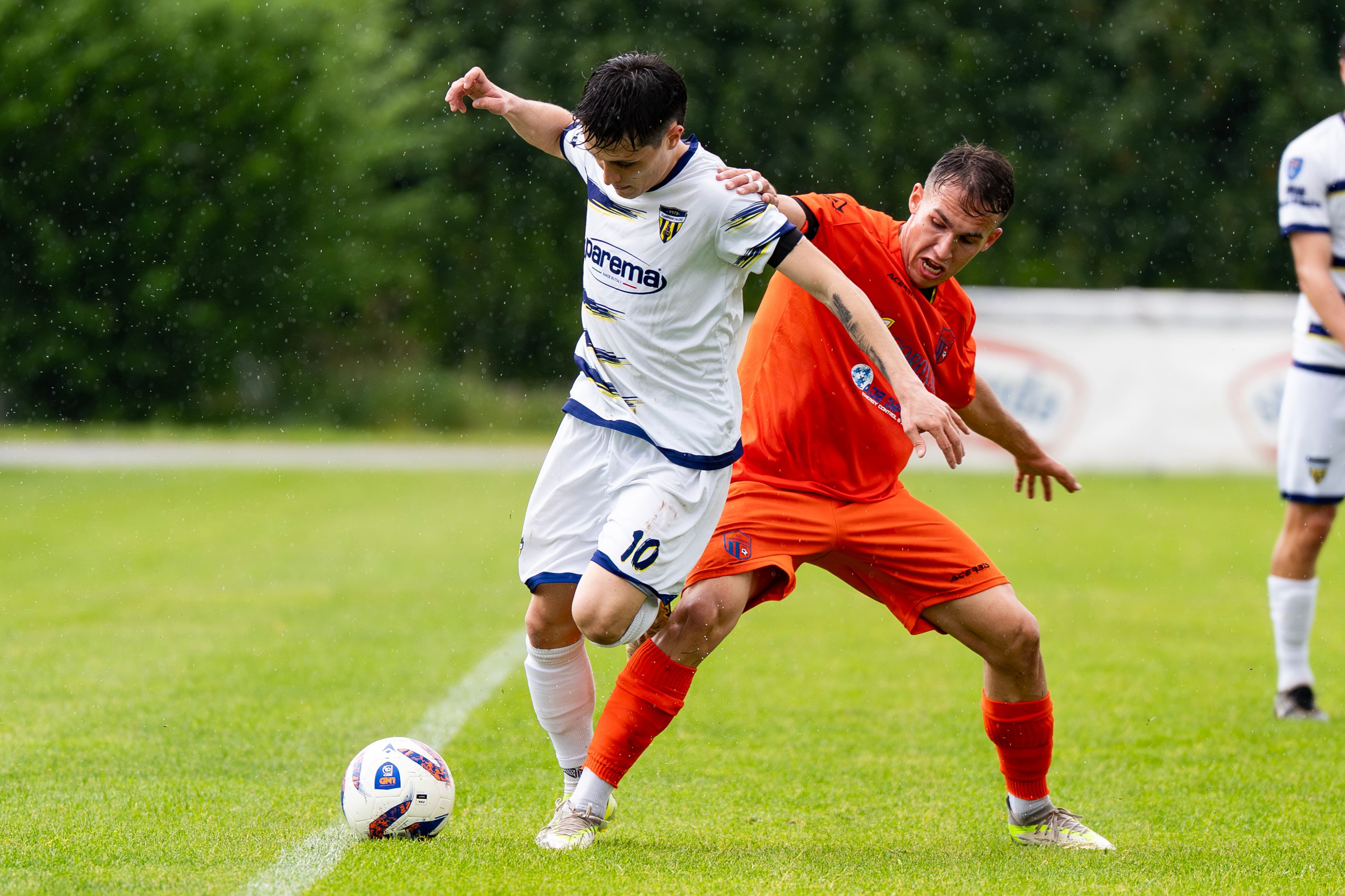 Intense Soccer Match in the Rain · Free Stock Photo