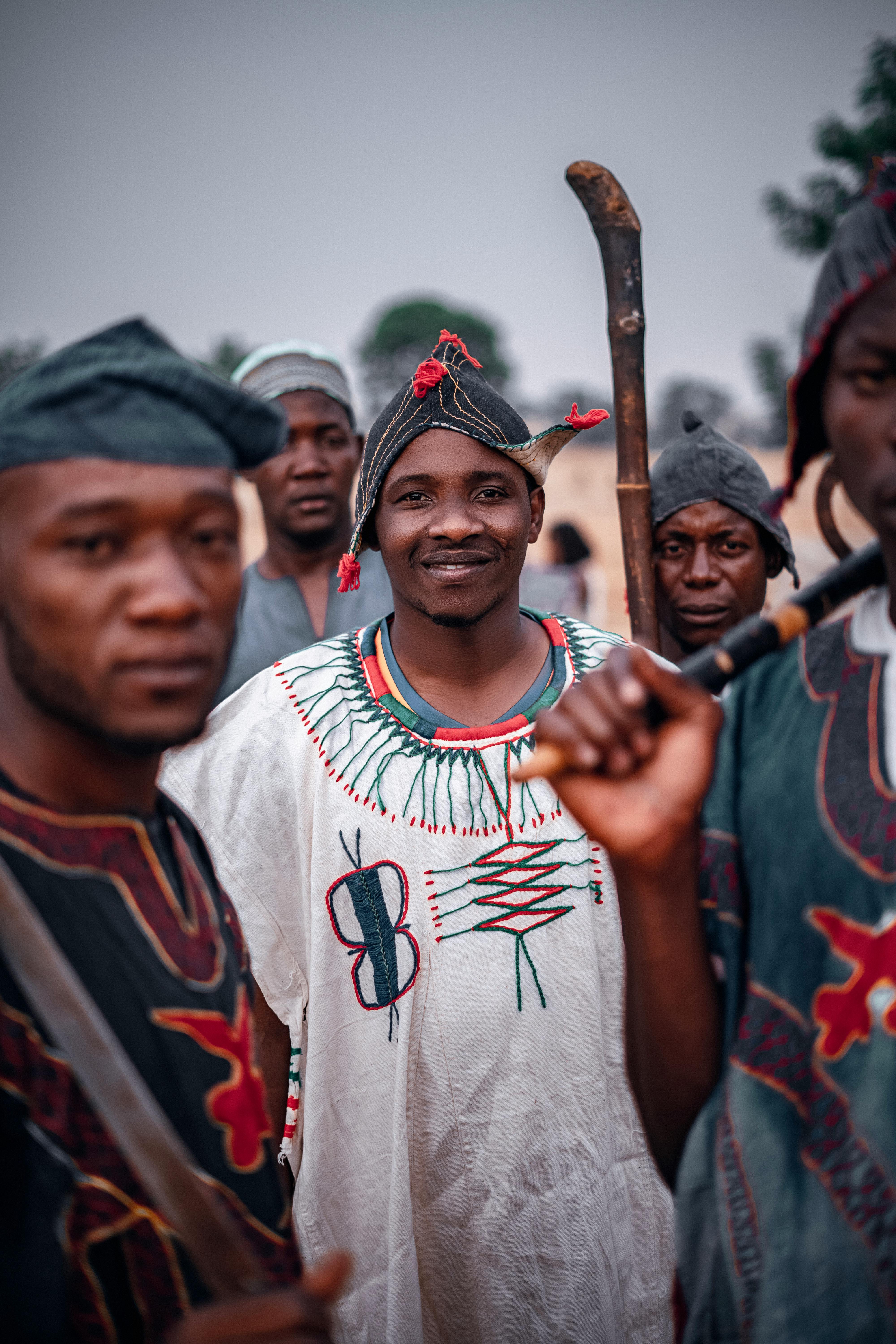 Nigerian Men in Traditional Hausa Attire Celebrating · Free Stock Photo