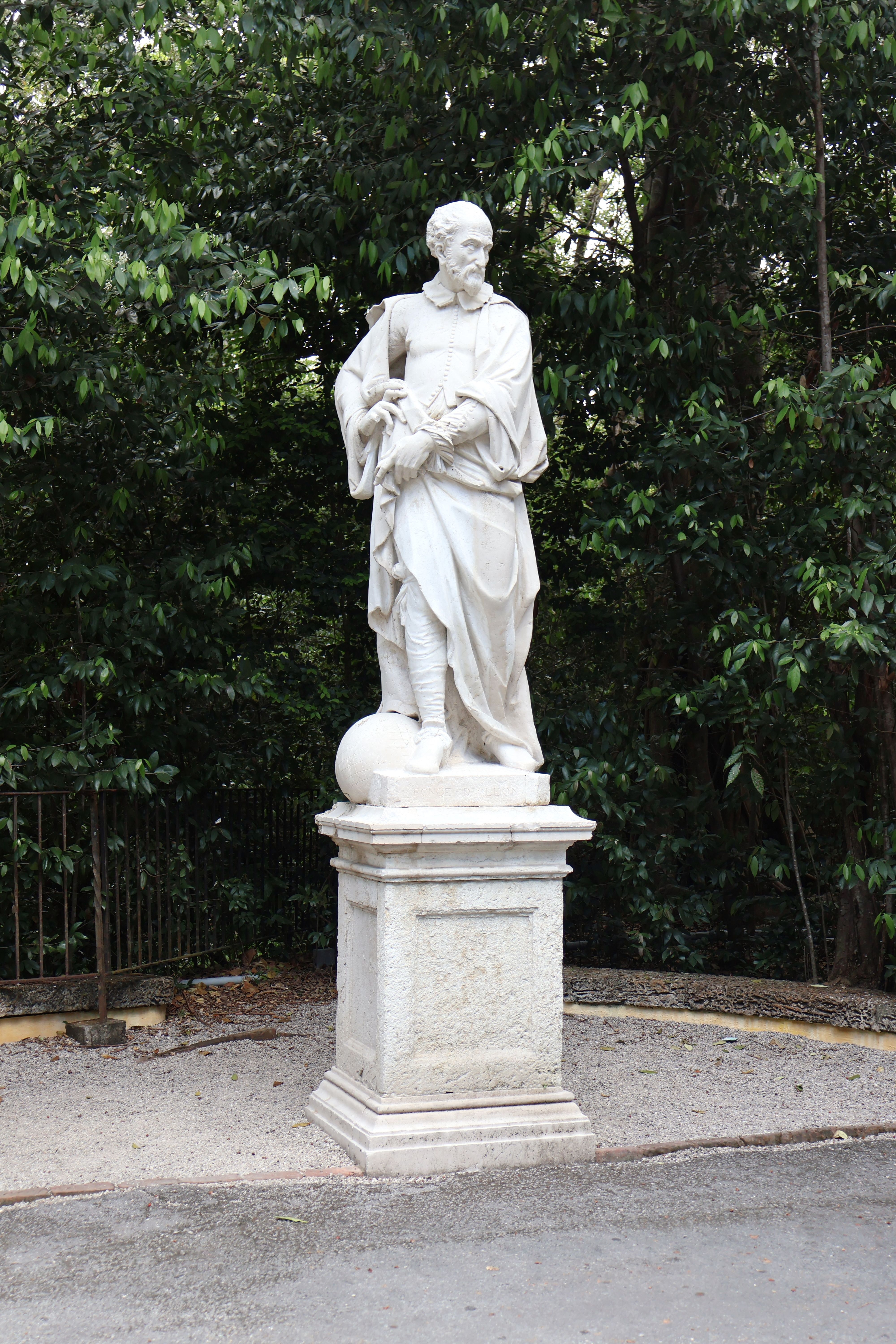 Renaissance Statue Surrounded by Lush Greenery · Free Stock Photo