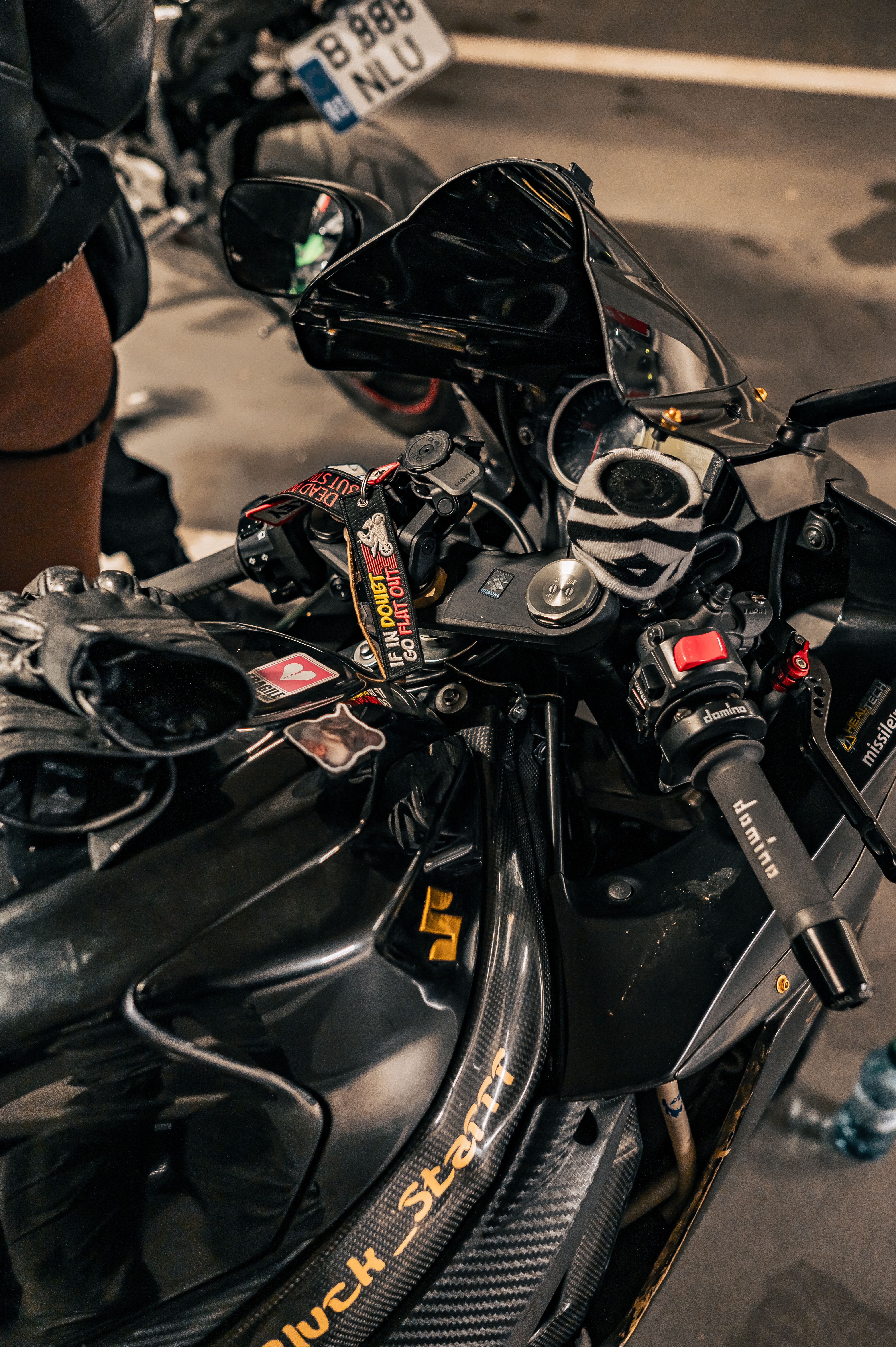 Close-up of Black Motorcycle Handlebars at Night · Free Stock Photo