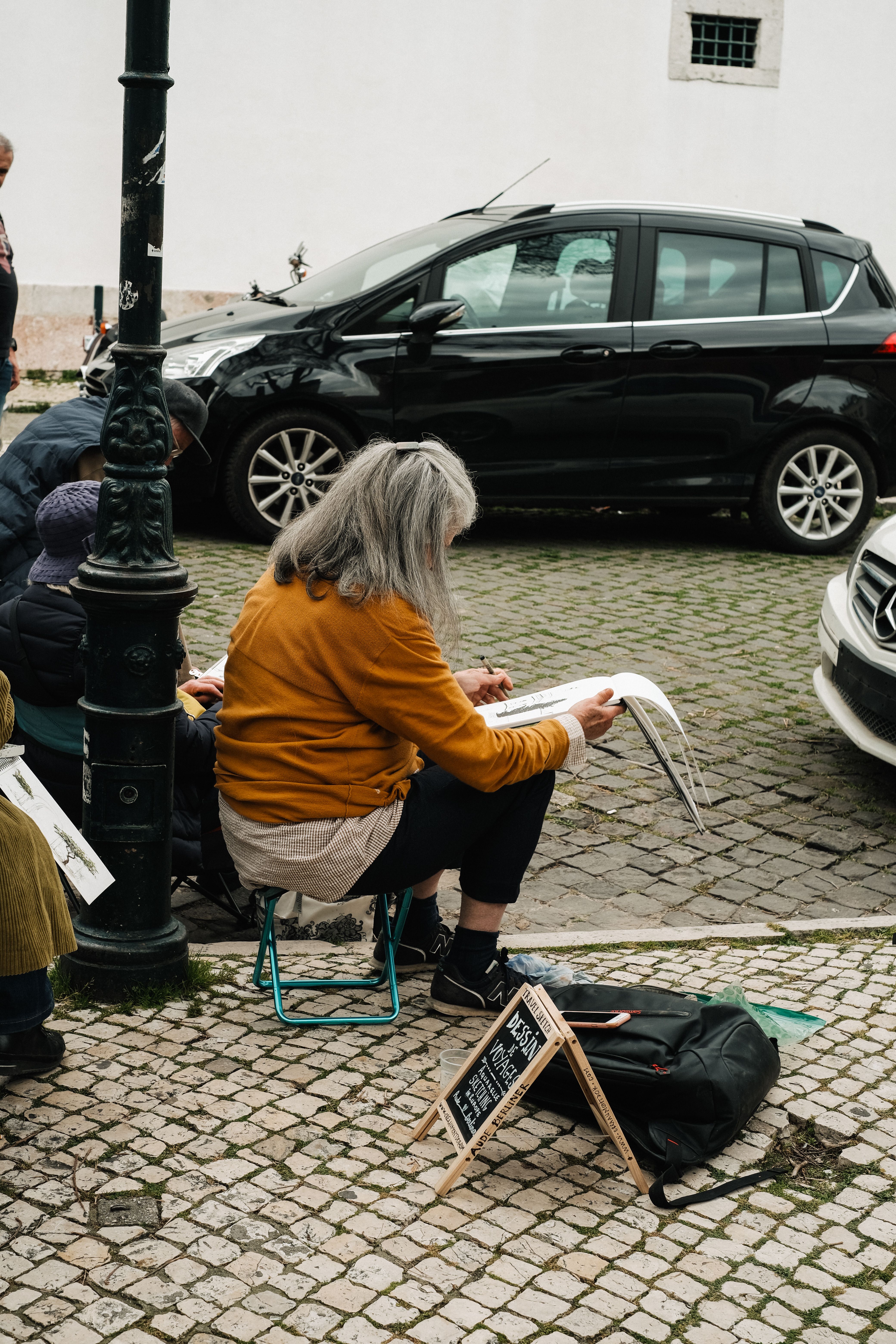 Street Artist Drawing Outdoor Scene in Urban Area · Free Stock Photo